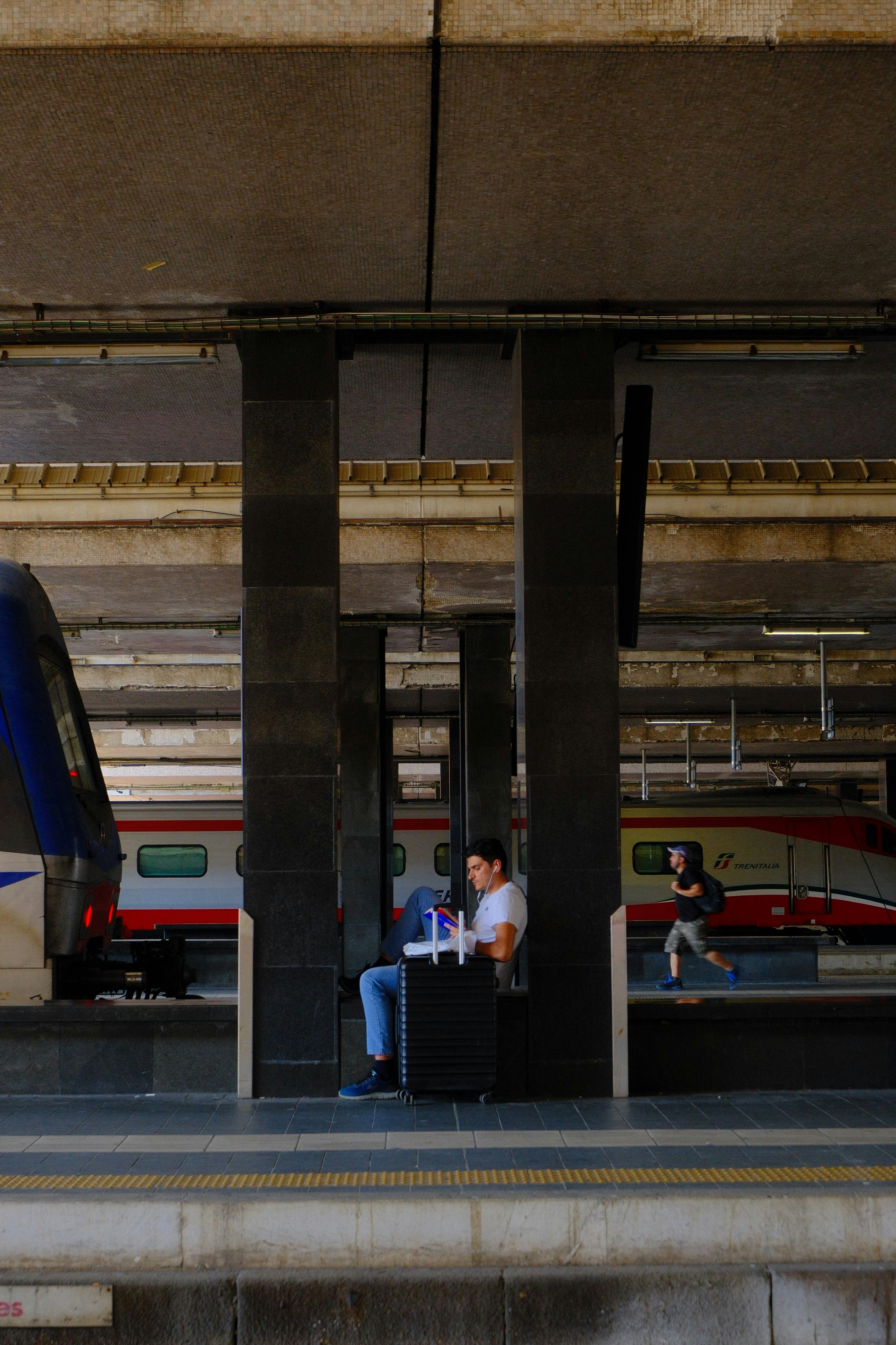 Platform Pause: A Traveler in Quiet Focus