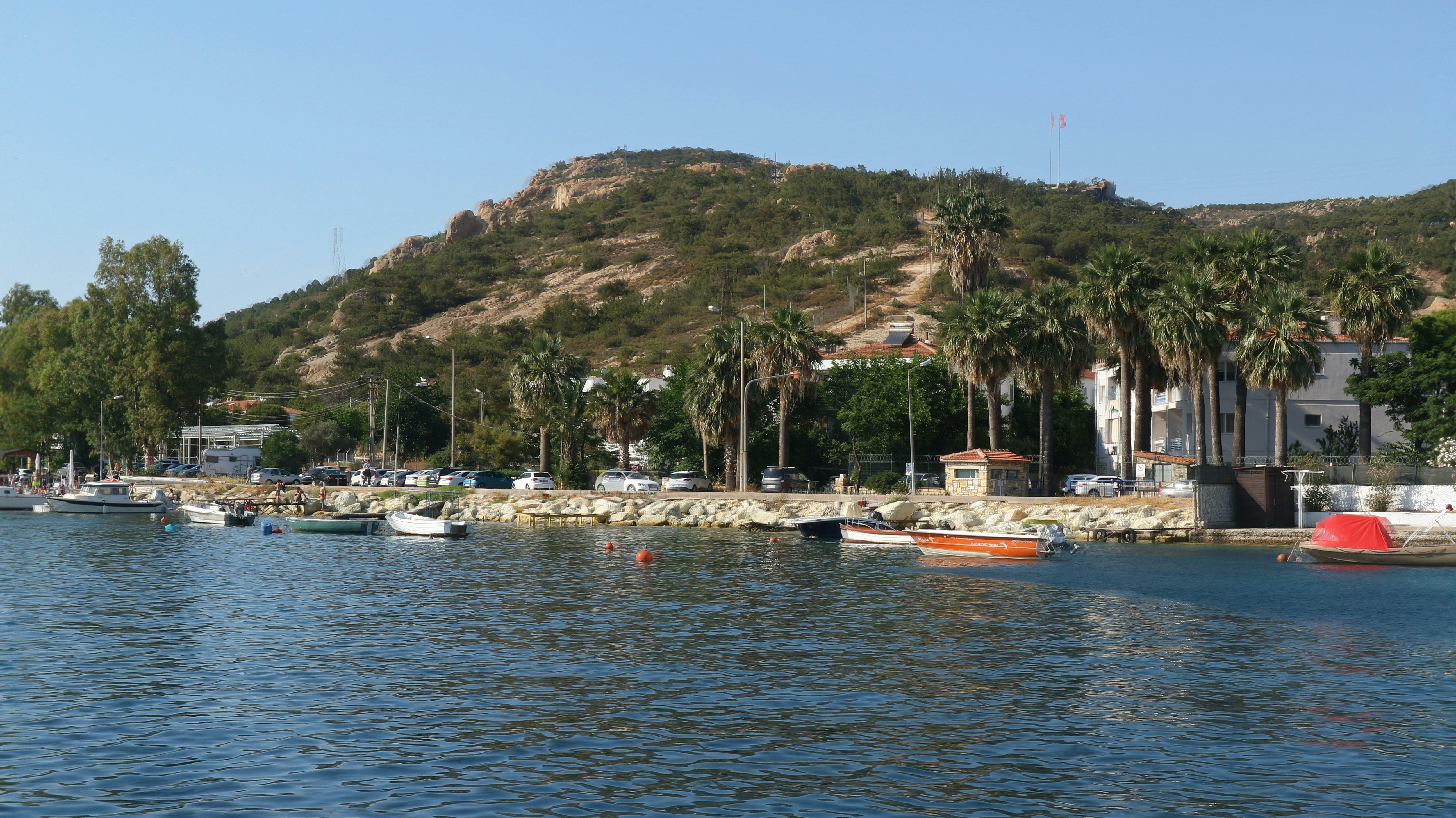 Harbor Quiet: Boats Point to a Hillside Village