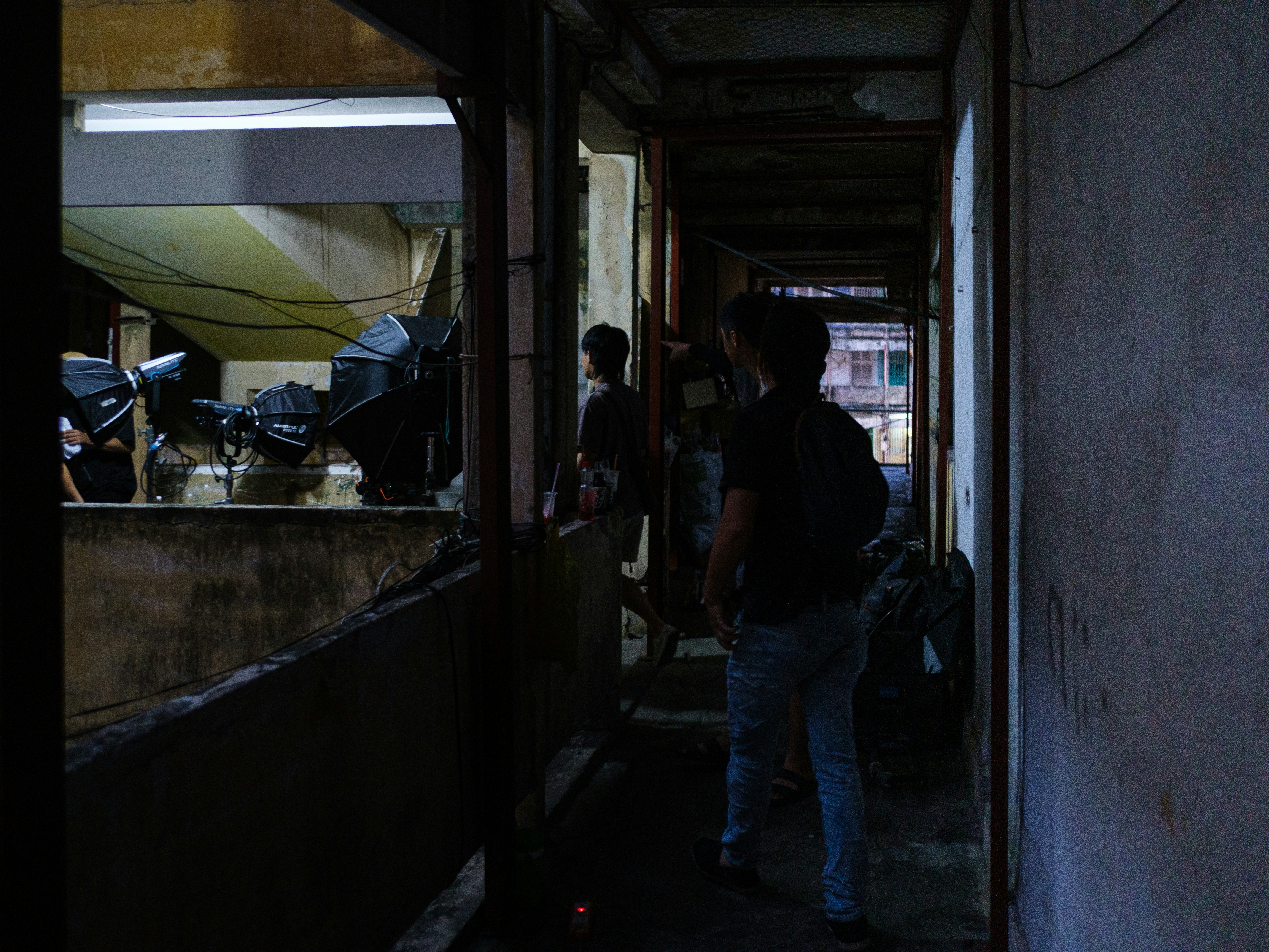 Dim Corridor Studio: Quiet Crew in a Backstage Alley