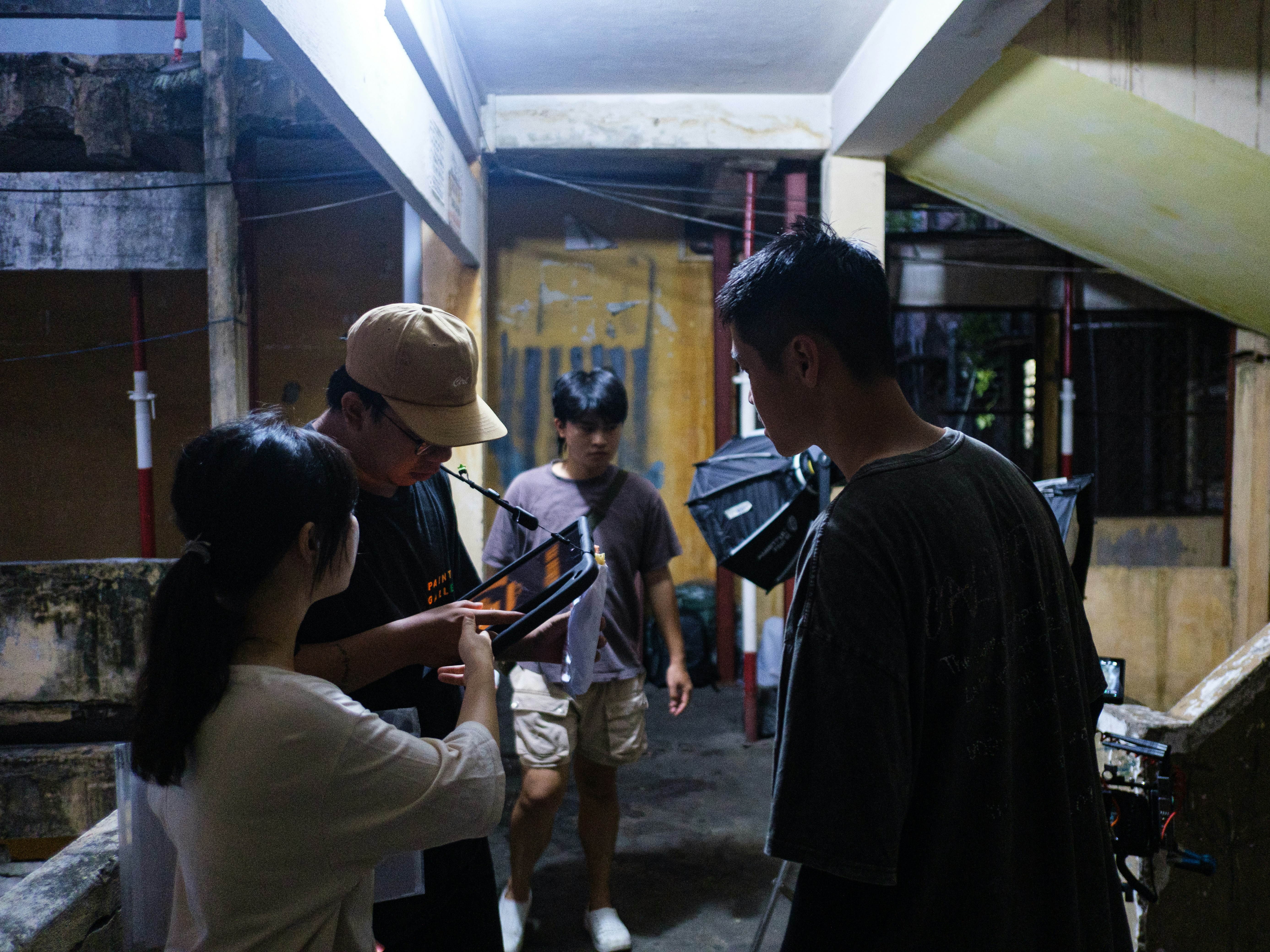 Low-Light Crew Session: Sharing a Script Under the Concrete Stairs
