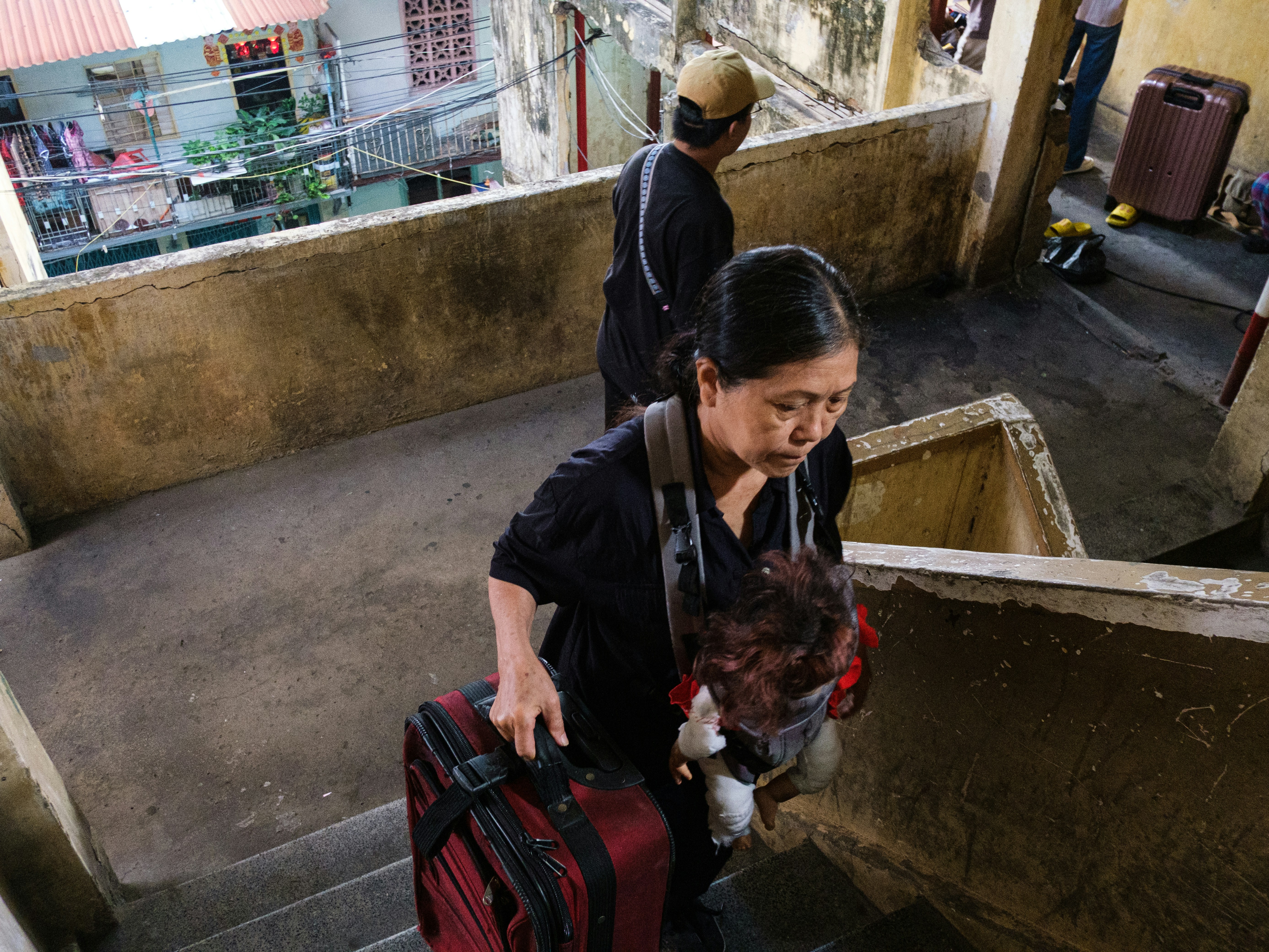 Carrying Joy: A Mother and Child Descend a Step in a Tangled Urban Staircase