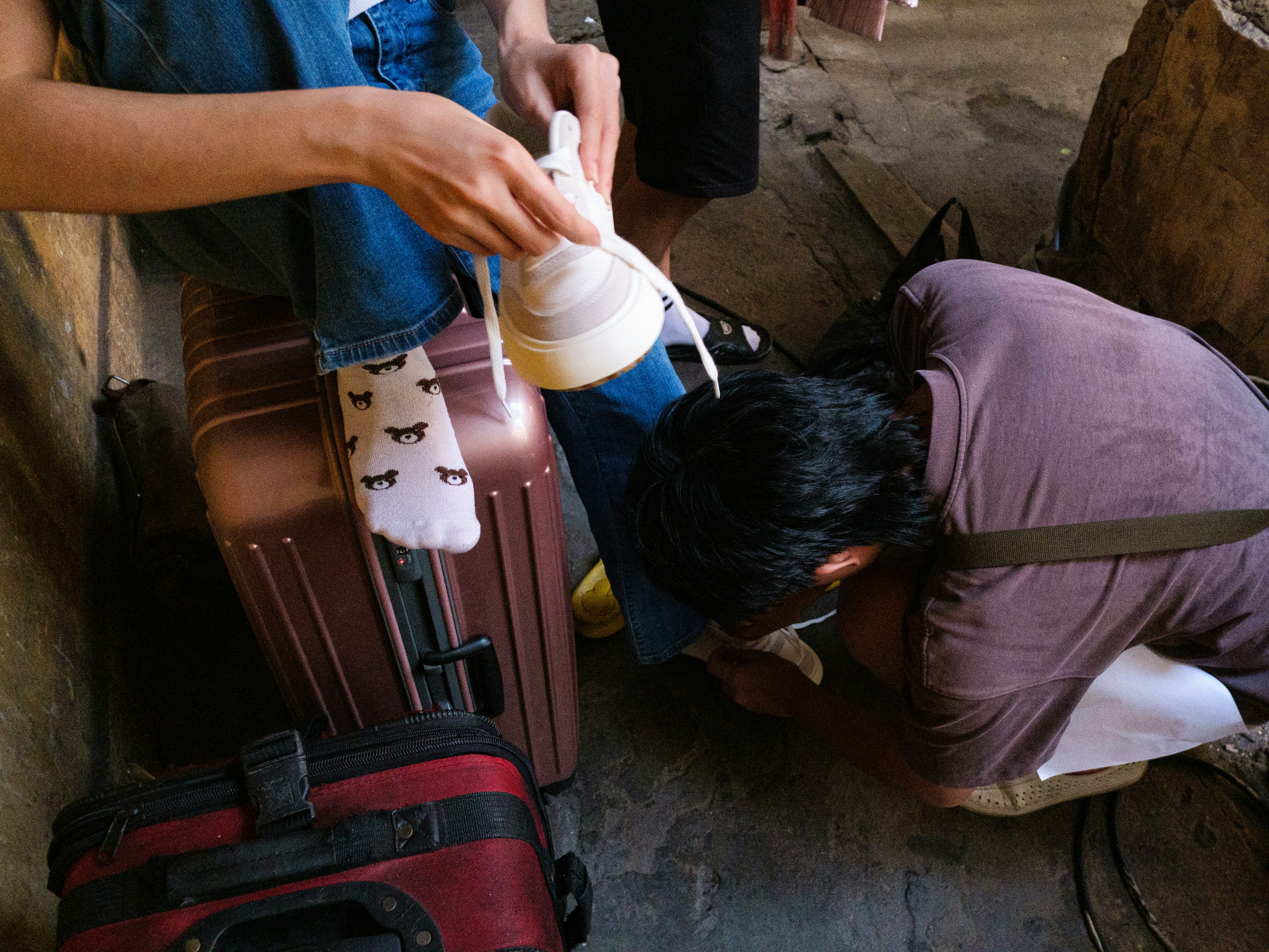 Hands, Bottled Water, and a Stranded Passenger: A Quiet Moment in Transit