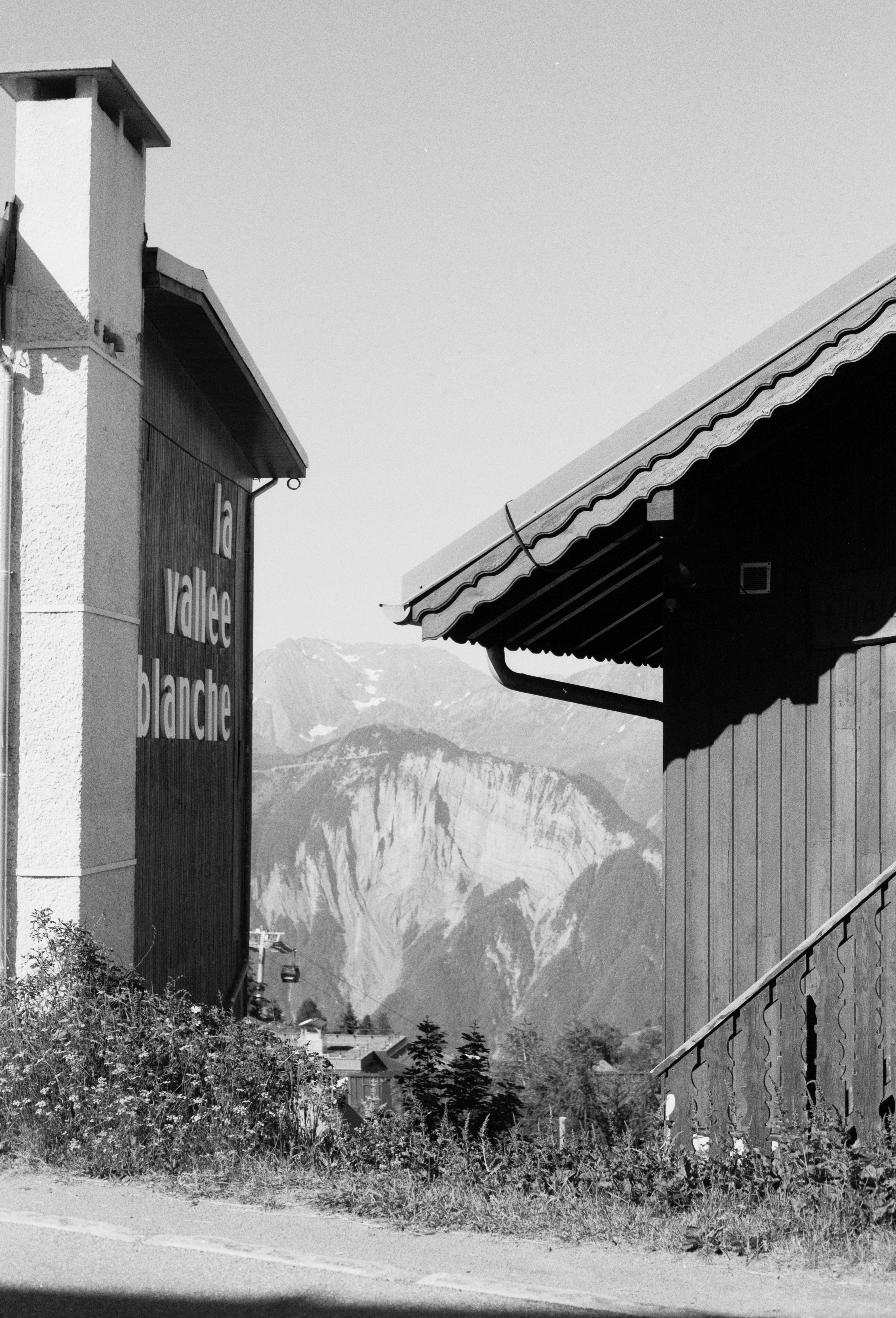 Between Alpine Facades: A Quiet Valley Framed by Timber and Stone