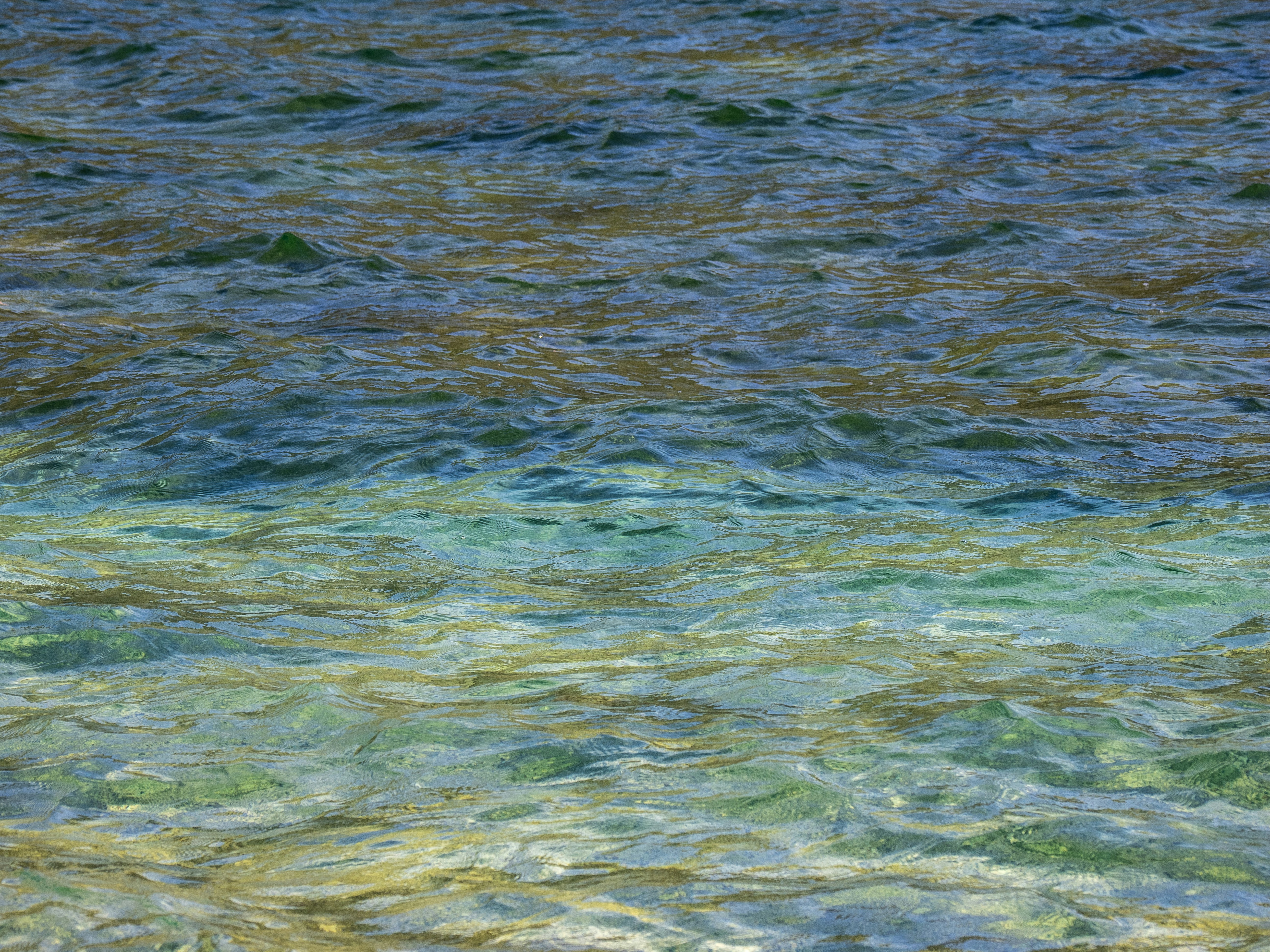 Clear Coastal Strata: Sunlit Shallows on Turquoise Seascape
