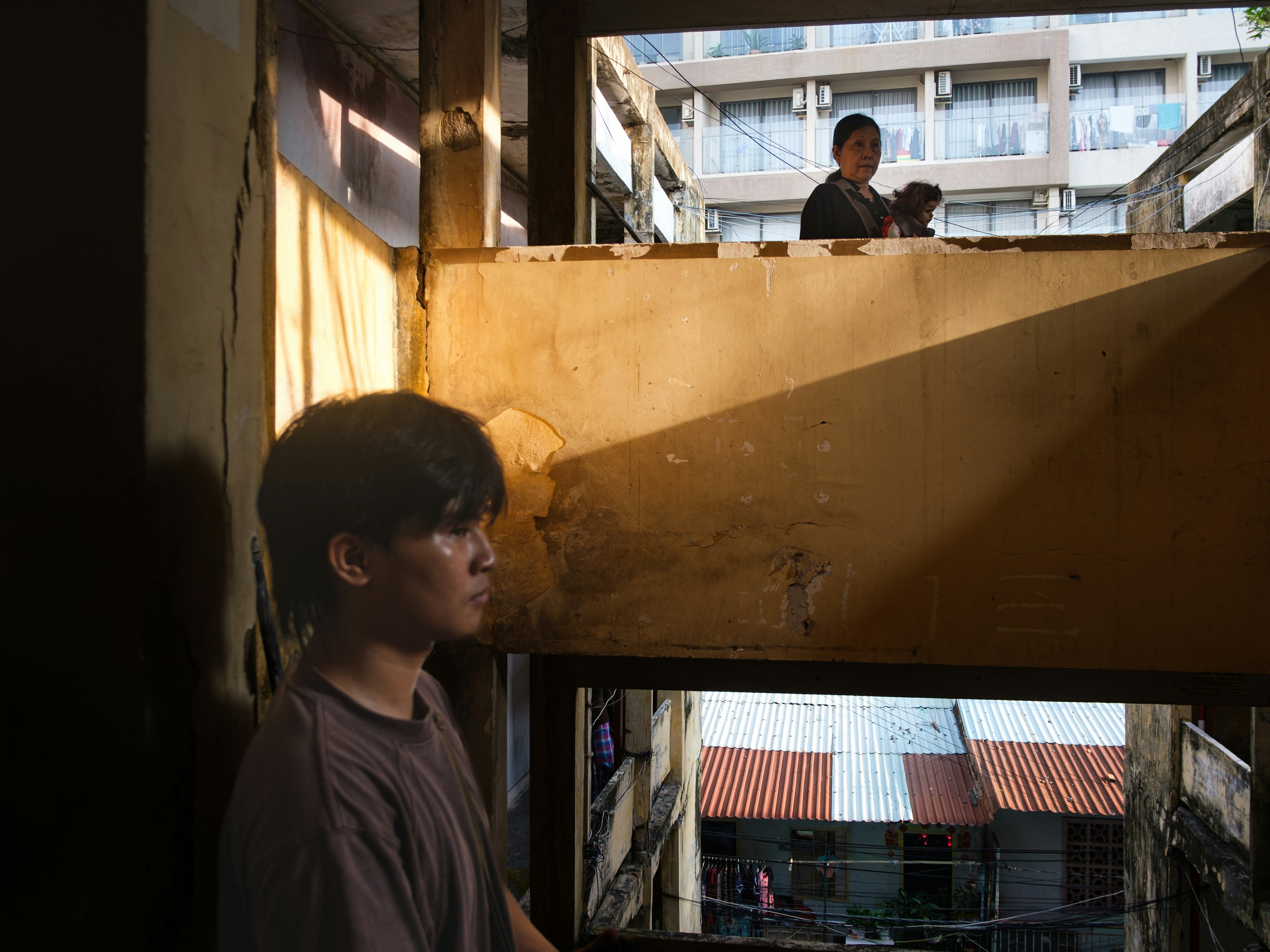 Concrete Echoes: A Quiet Portrait in a Distant Alleyway