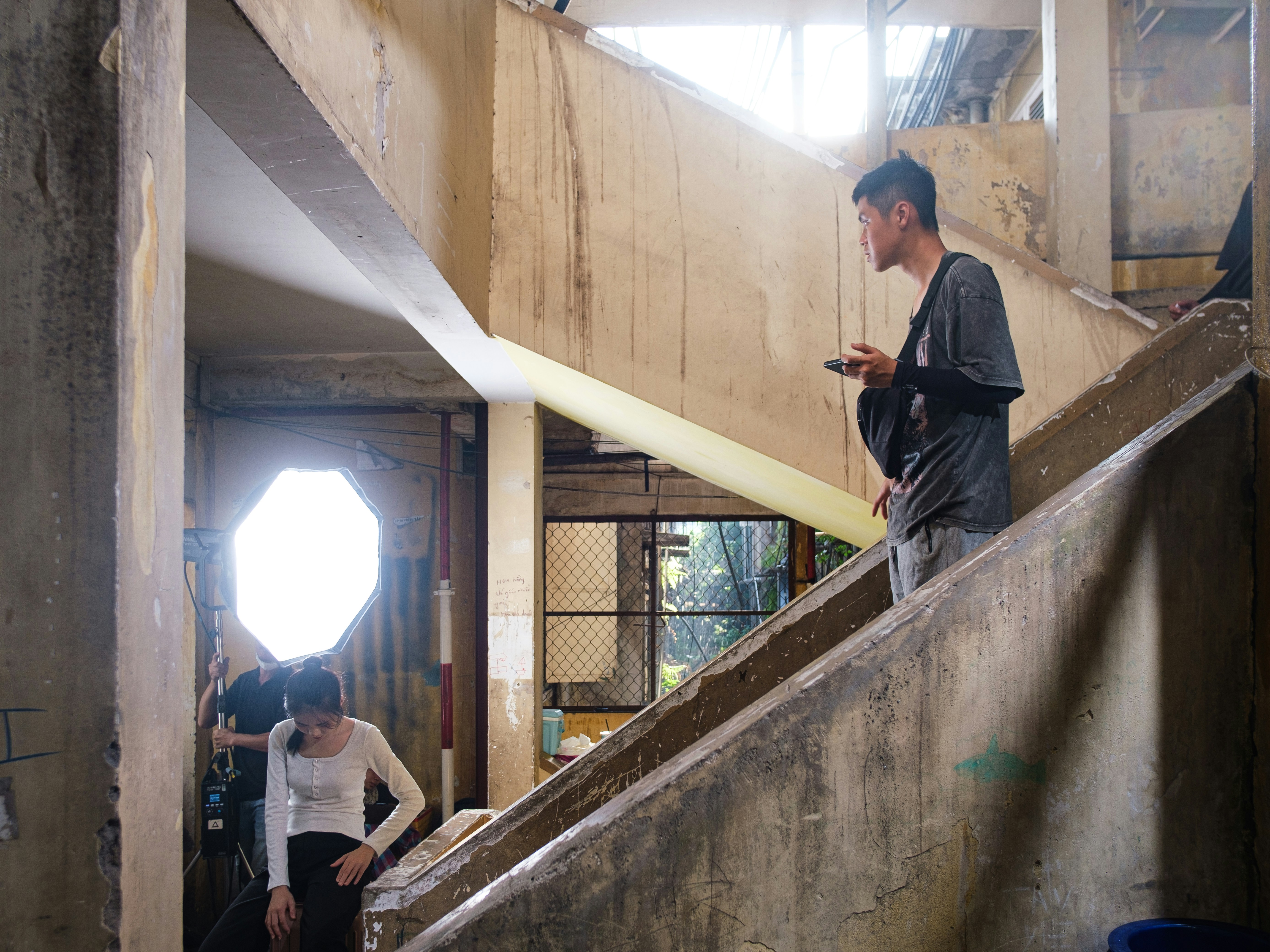 Industrial Staircase Portrait: A Silent Moment in Concrete Echoes