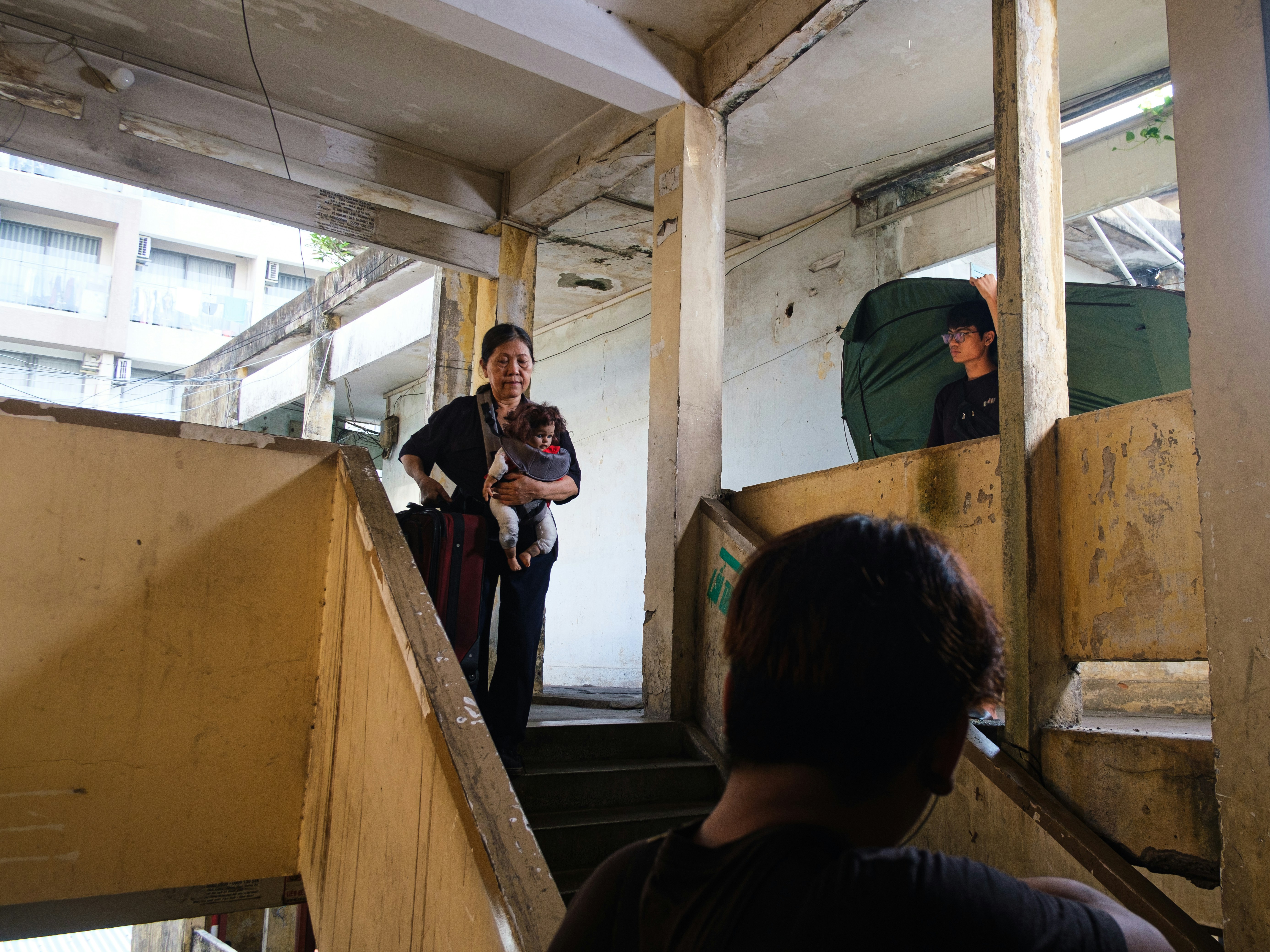 Stairwell Conversation: A Brief Pause in the Concrete Atrium