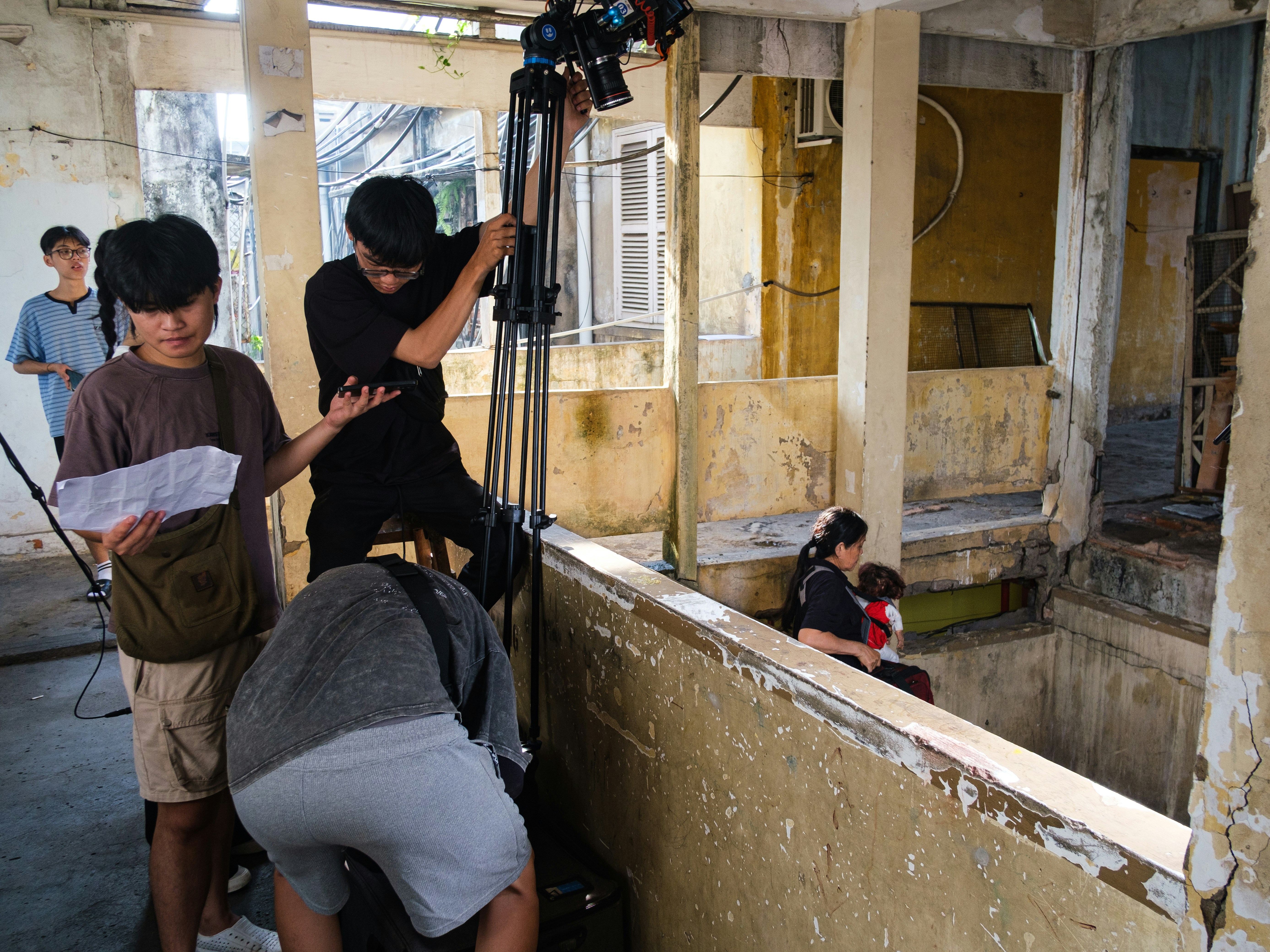 Behind the Set: On-Location Crew Adjusts the Scene Between Takes