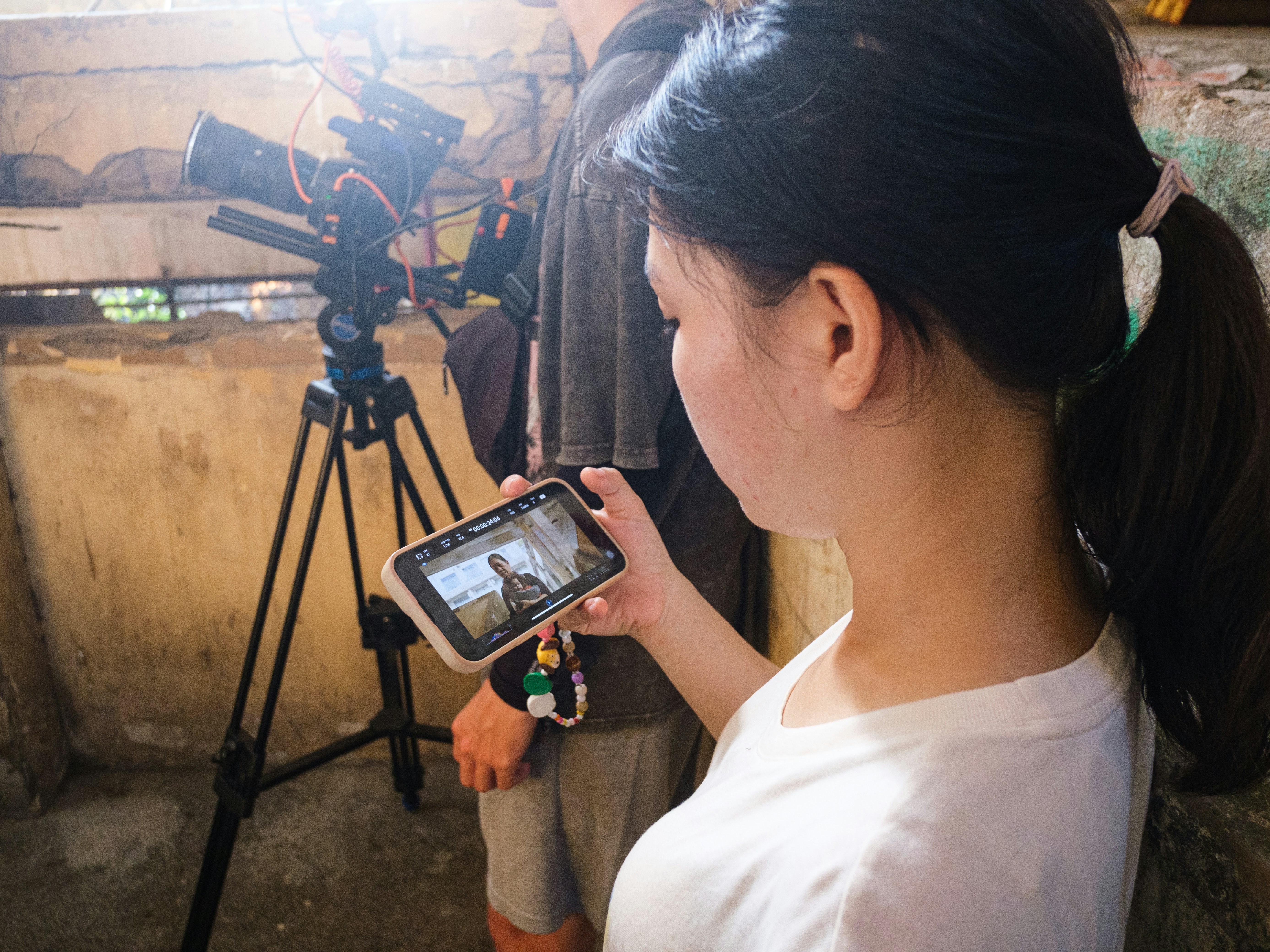 Focused Gaze: A Behind-the-Scenes Moment with a Smartphone Screen Capture