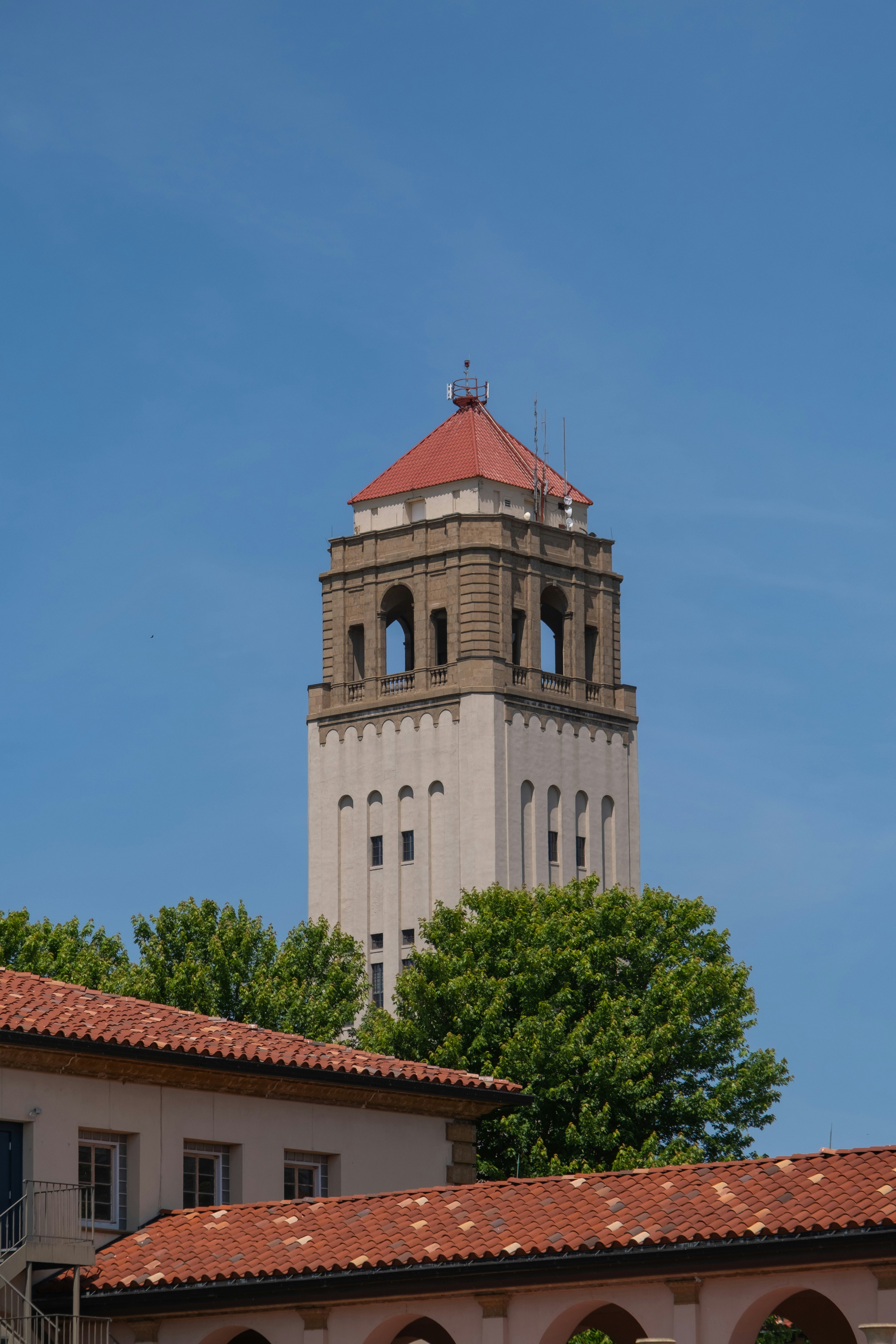 Clocktower Rising Above Red-Tiled Rooftops