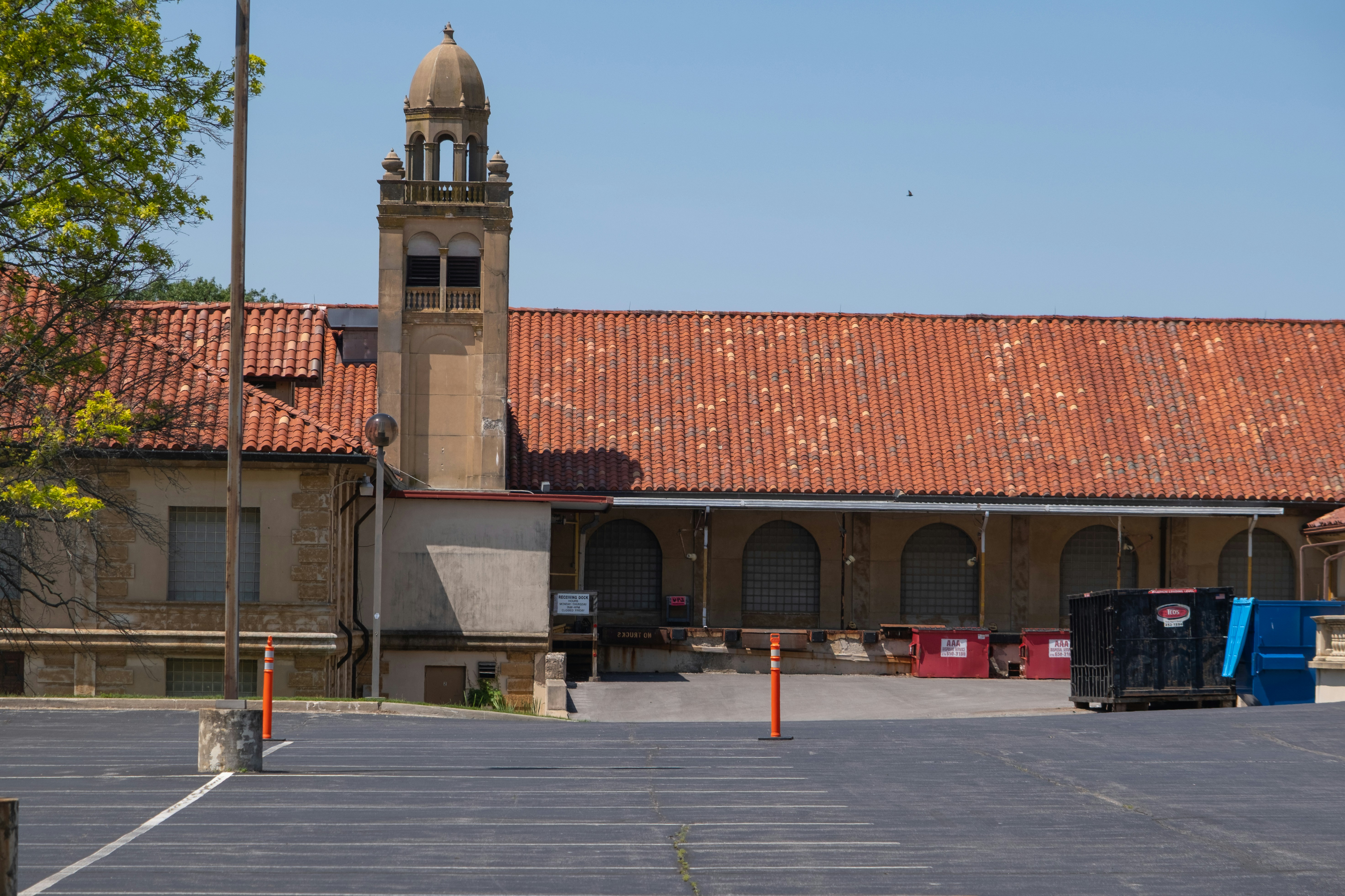 Arched Courtyard, Red-Tiled Roofs and a Lone Bell Tower