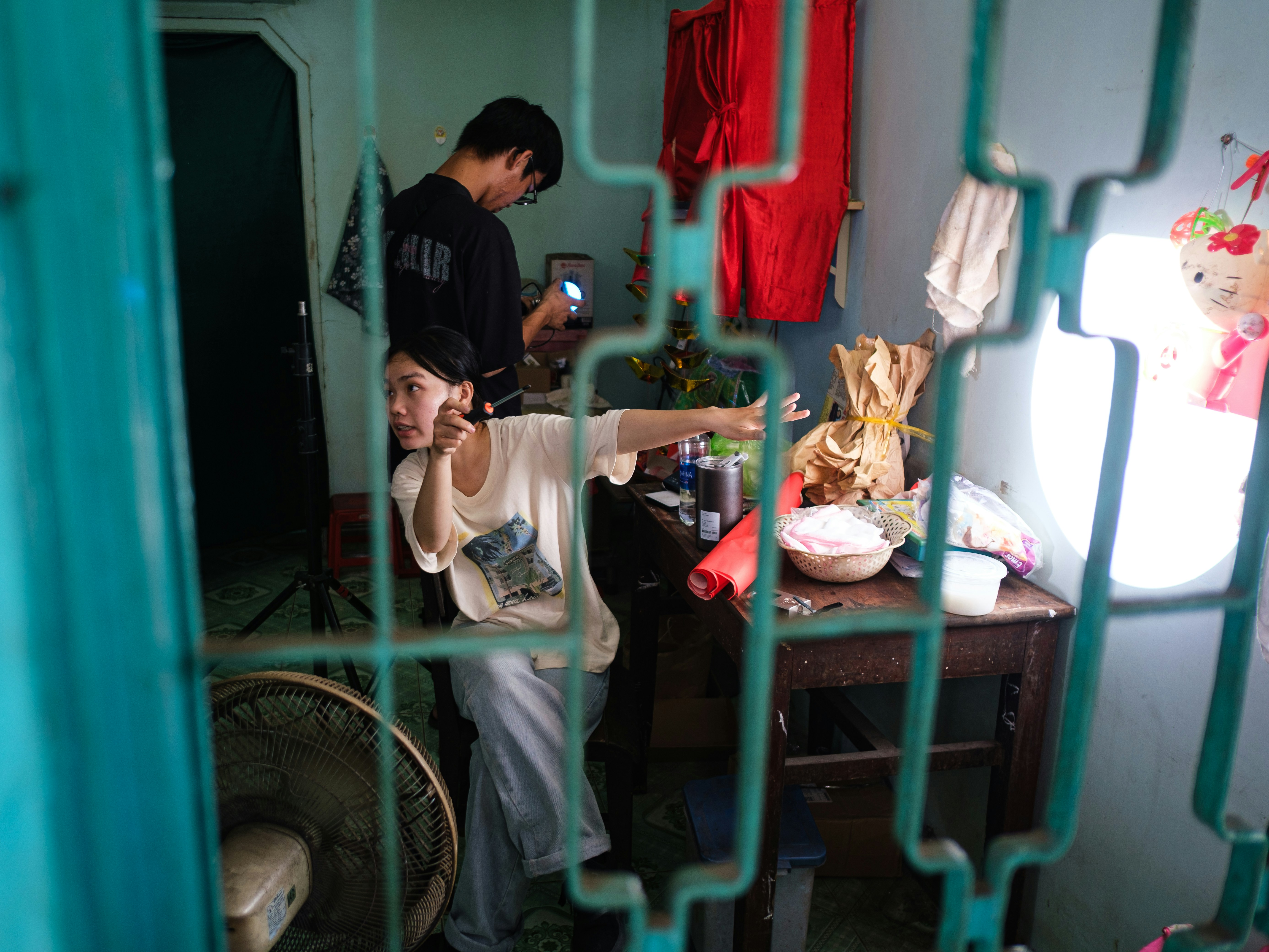 Behind the Curtain: A Moment in a Cozy Room