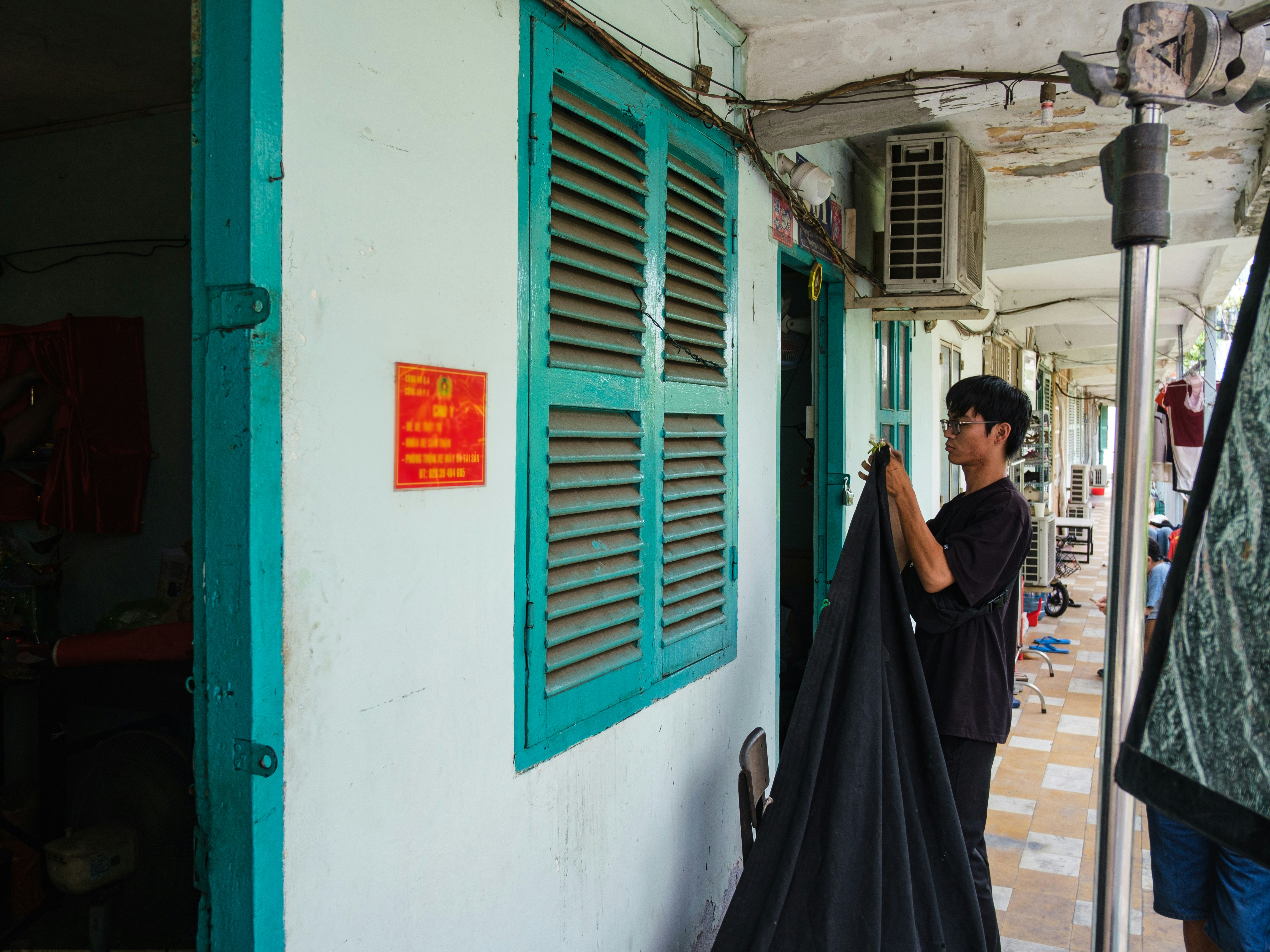 Threading Shadows: A Glimpse of Craft in a Quiet Corridor