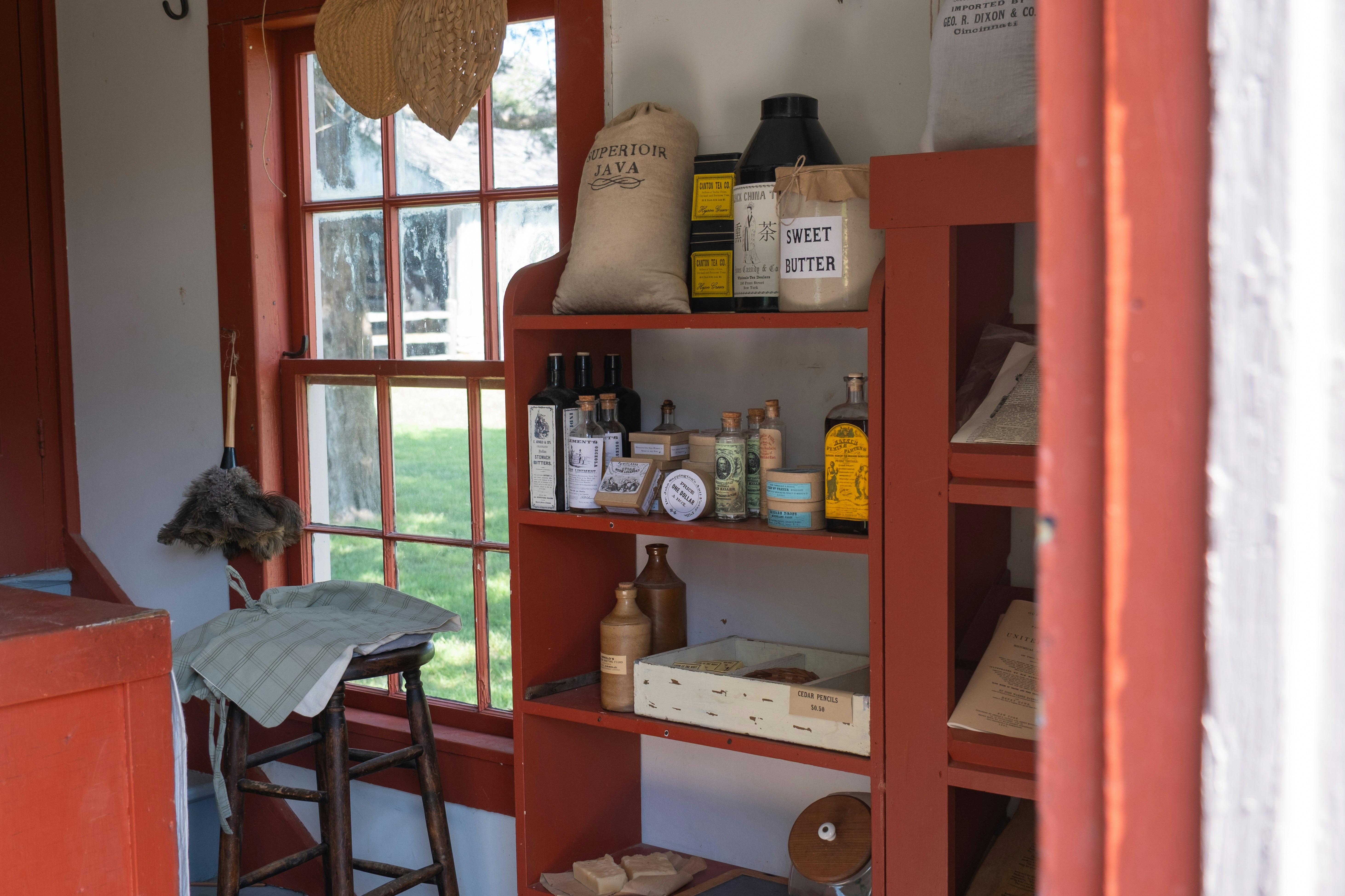 Rustic Apothecary Nook with Red Shelving