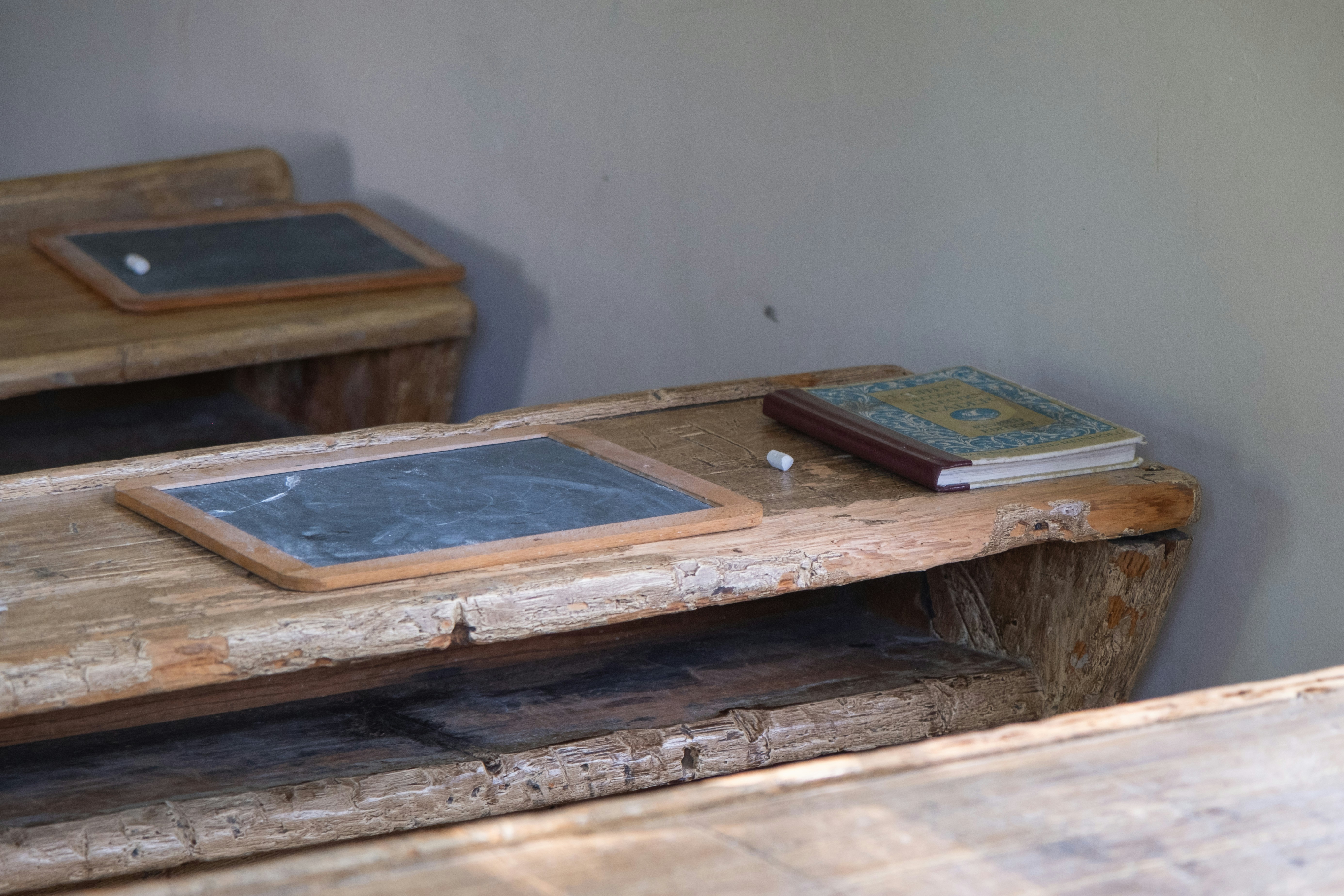 Dusty Chalkboard on a Weathered Desk
