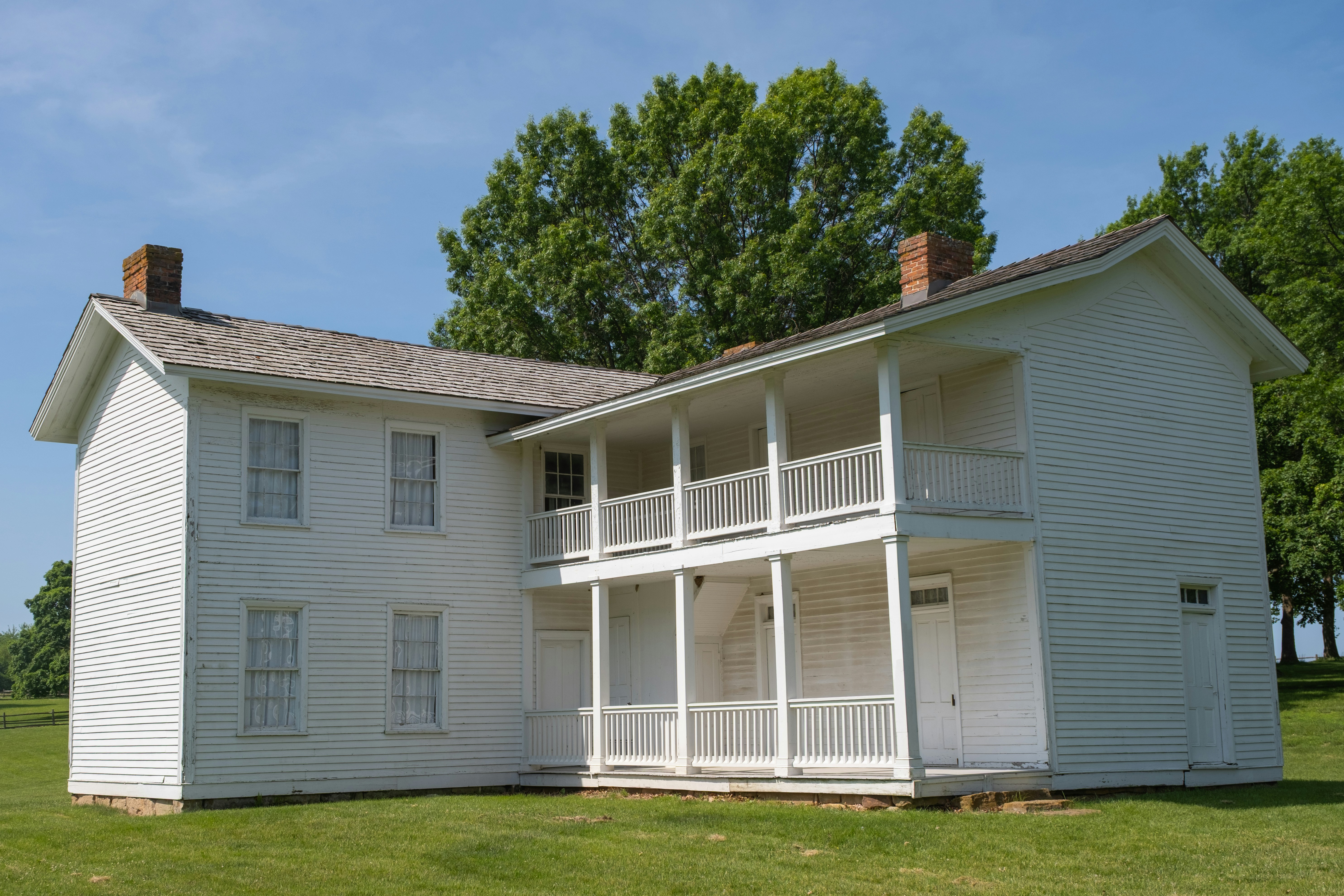 White Heritage: A Quiet Two-Story Fairfield House Under Blue Sky