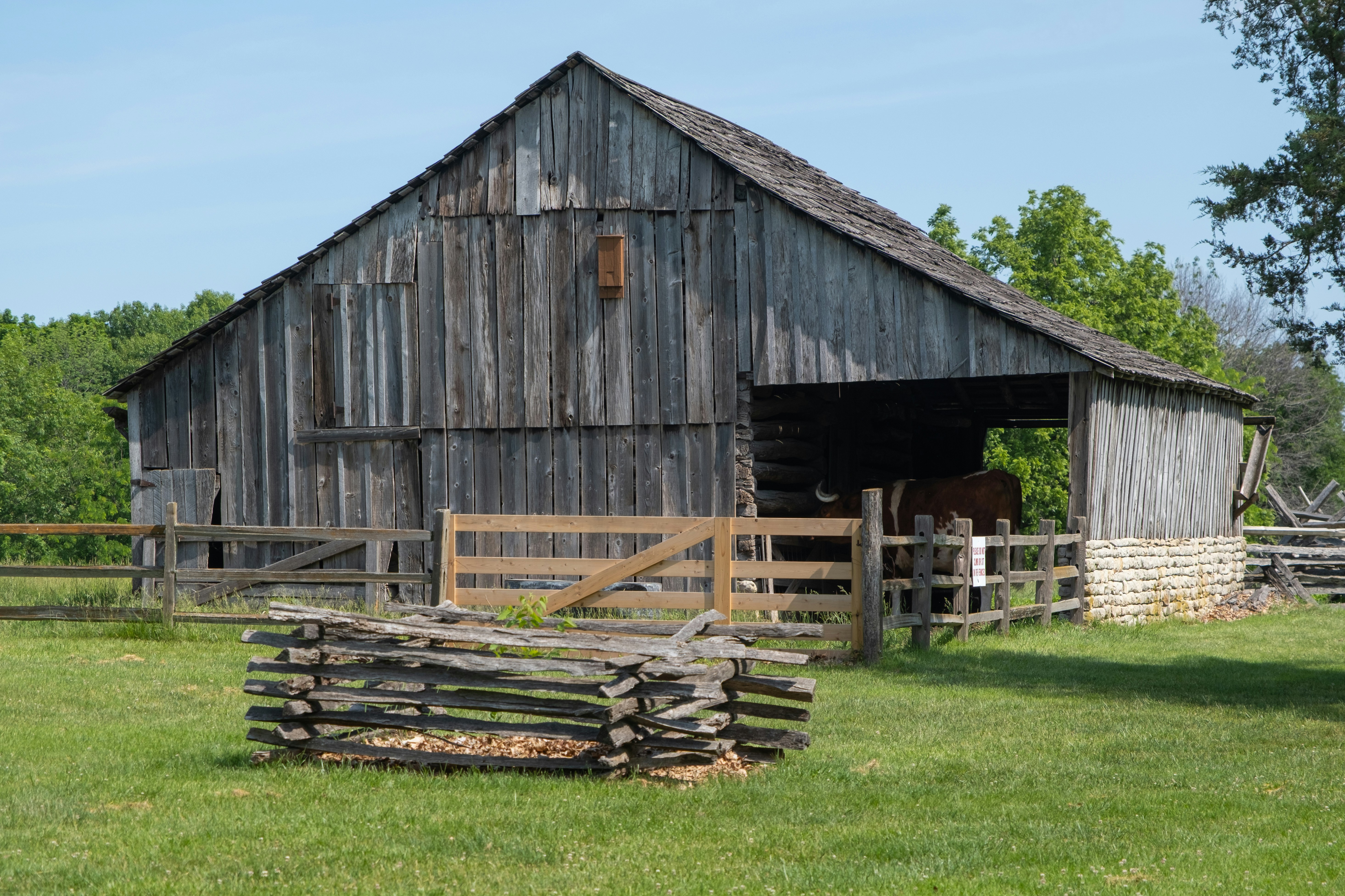 Weathered Barn and Fenced Pasture on a Sunny Day