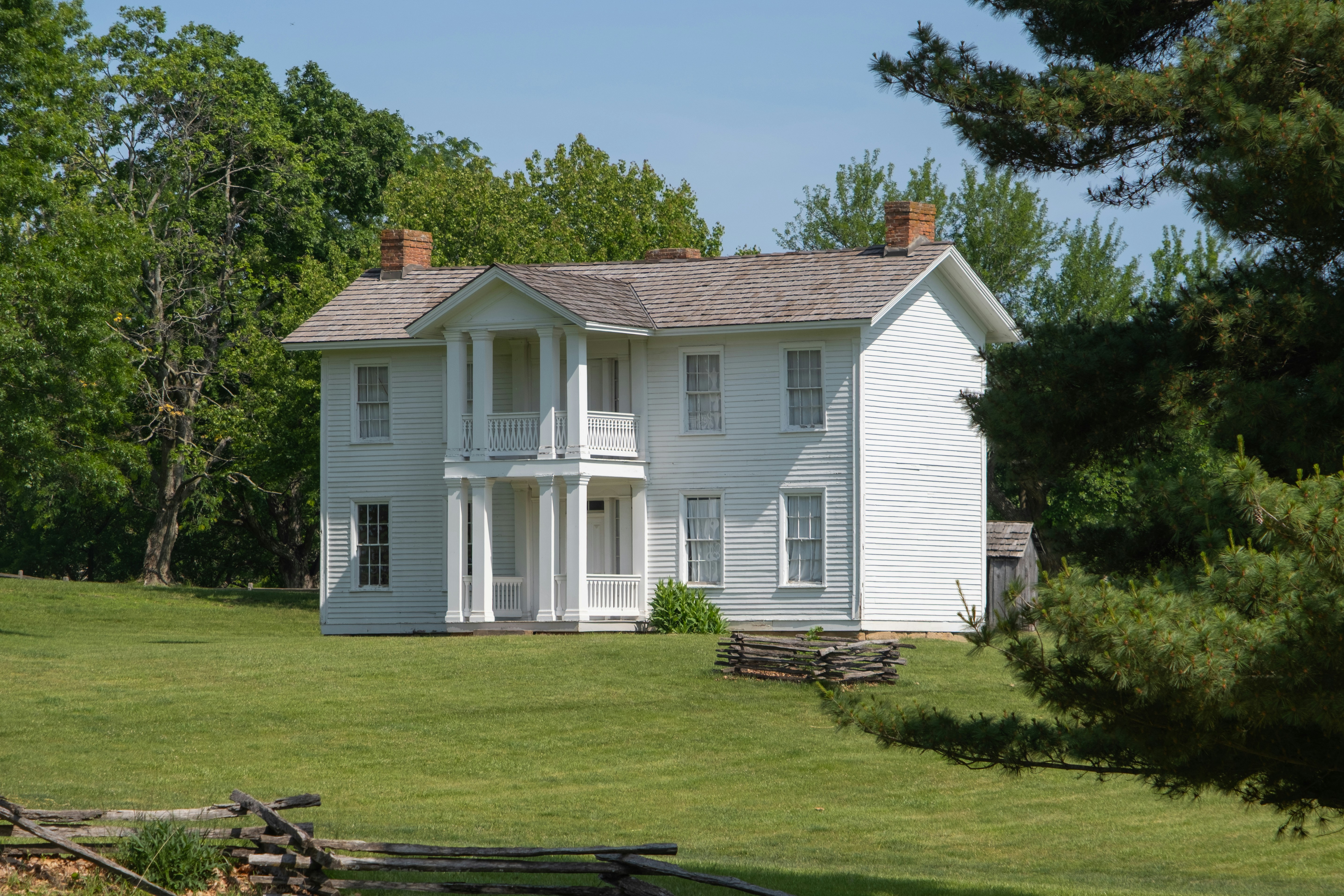 Quiet White Mansion in a Green Clearing