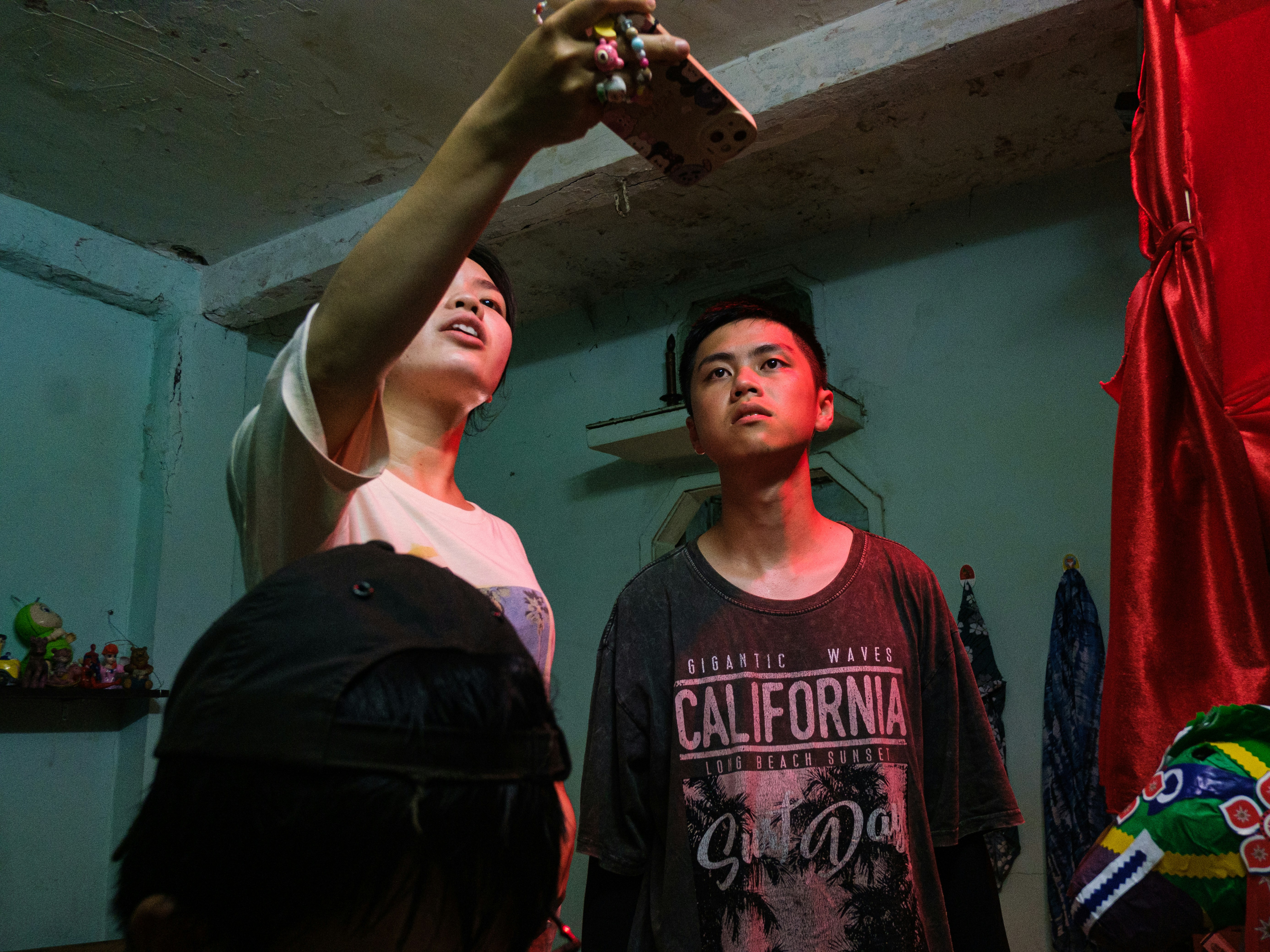 Selfie in a Dim Room: Two Amigos Under Neon