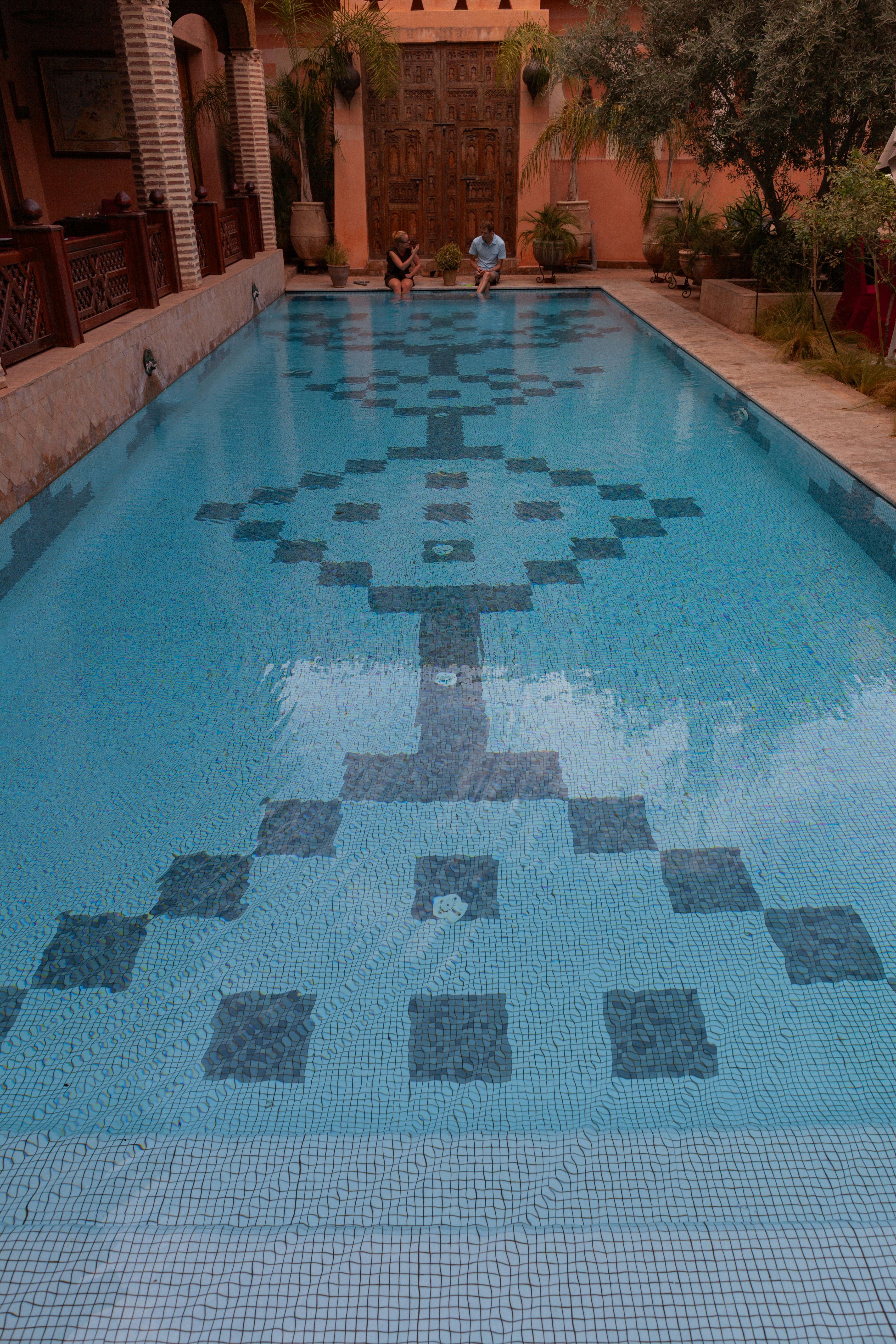 Symmetry in the Pool: Geometric Tiles Leading to a Quiet Court