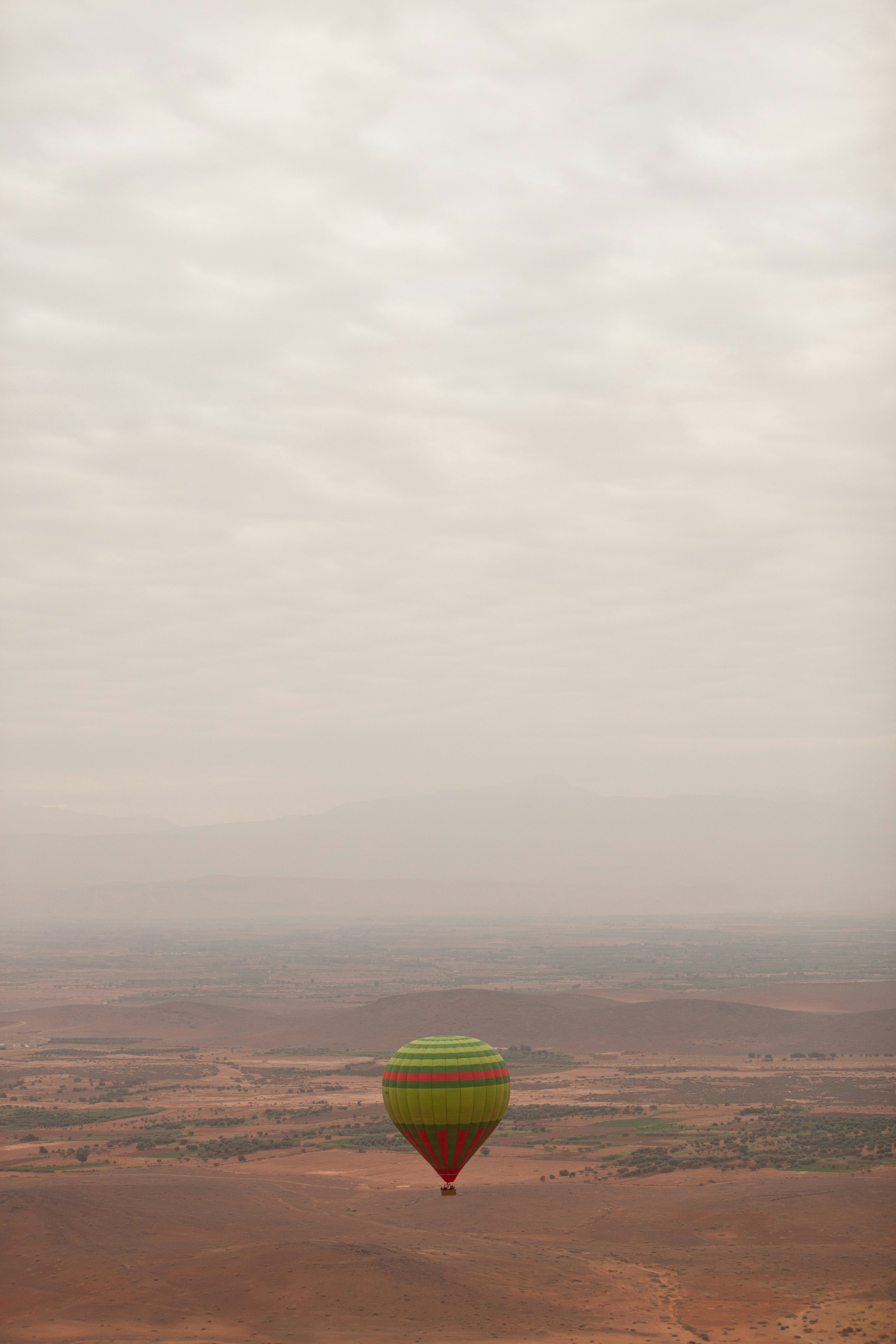 Emerald Ballon Above Desert Veil