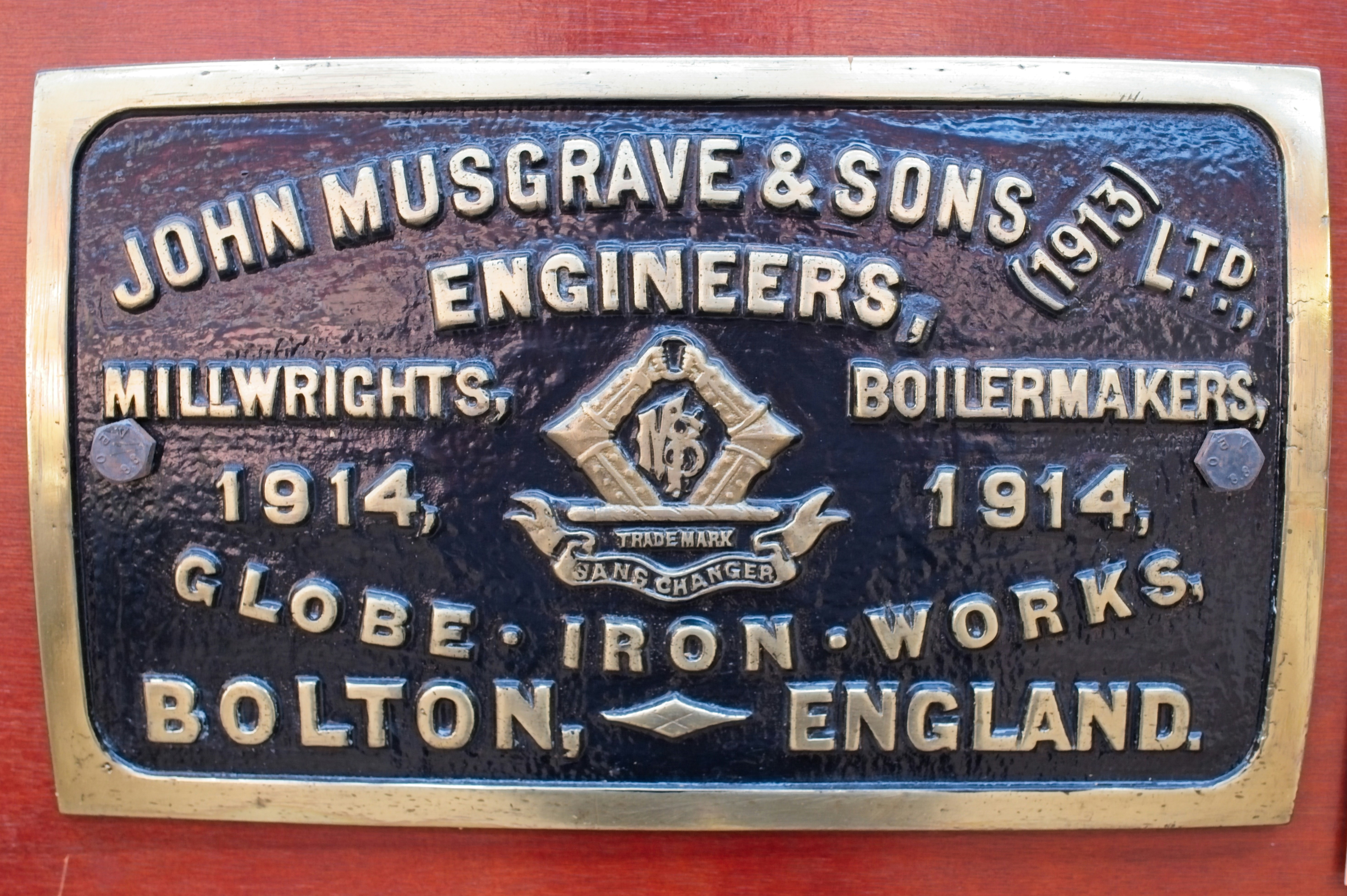Historic Boilerplate: emblem plaque of John Musgrave & Sons on a vintage boilerworks door