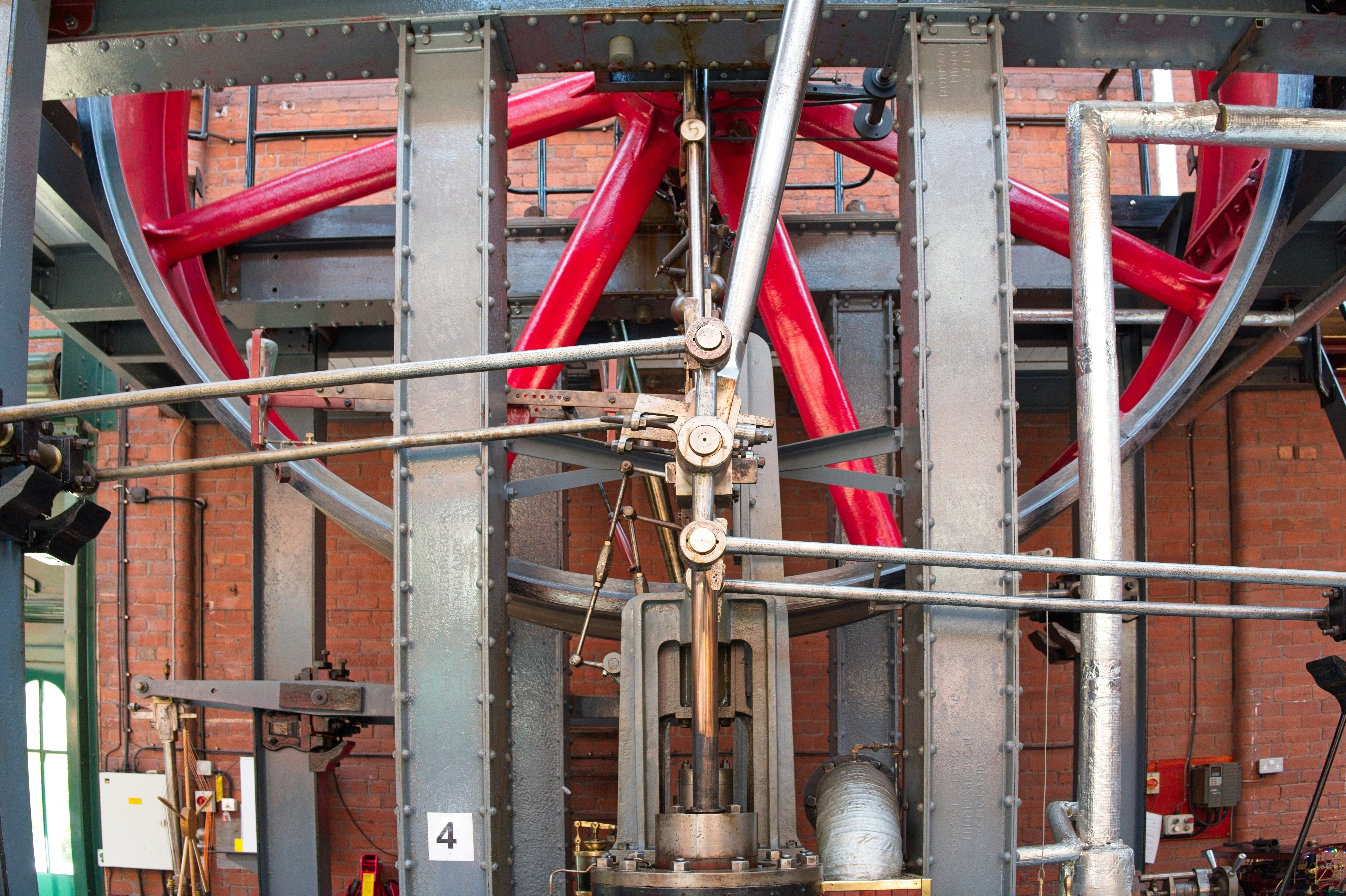 Intrinsic Mechanics: A Tangle of Pipelines and Cylinders in an Industrial Frame