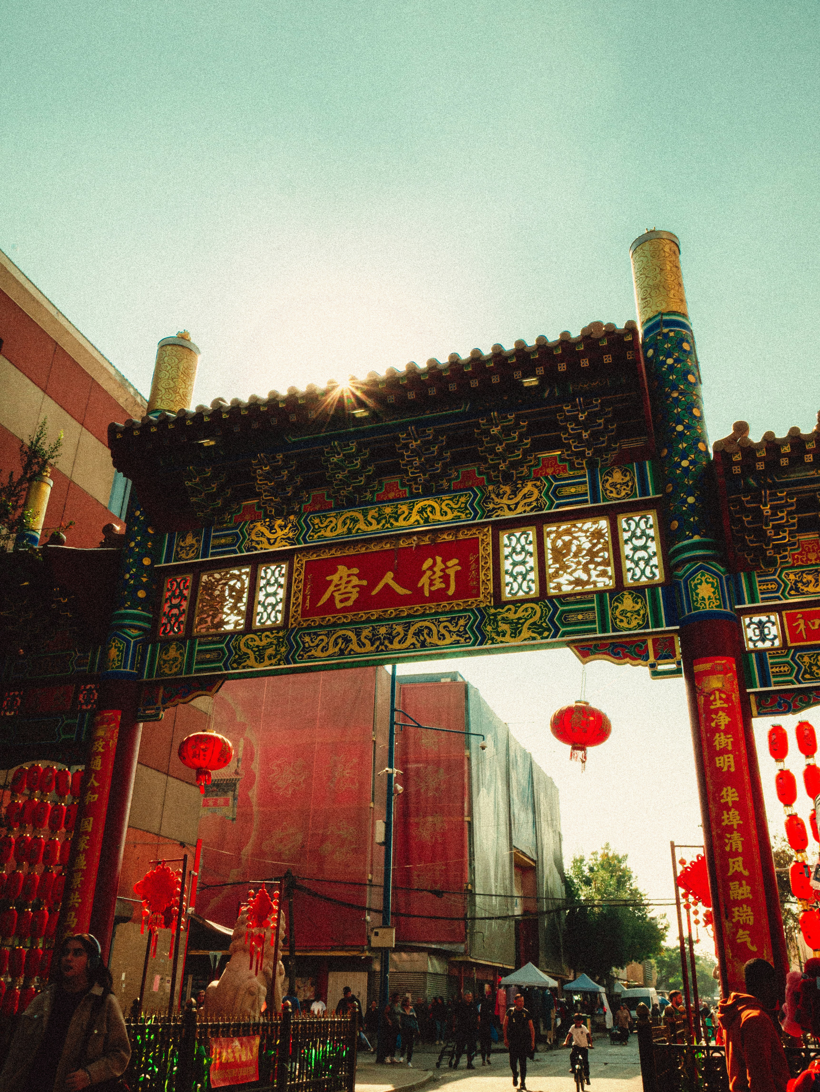 Sunlit Gate of Lanterns: A Cultural Threshold of Red and Gold