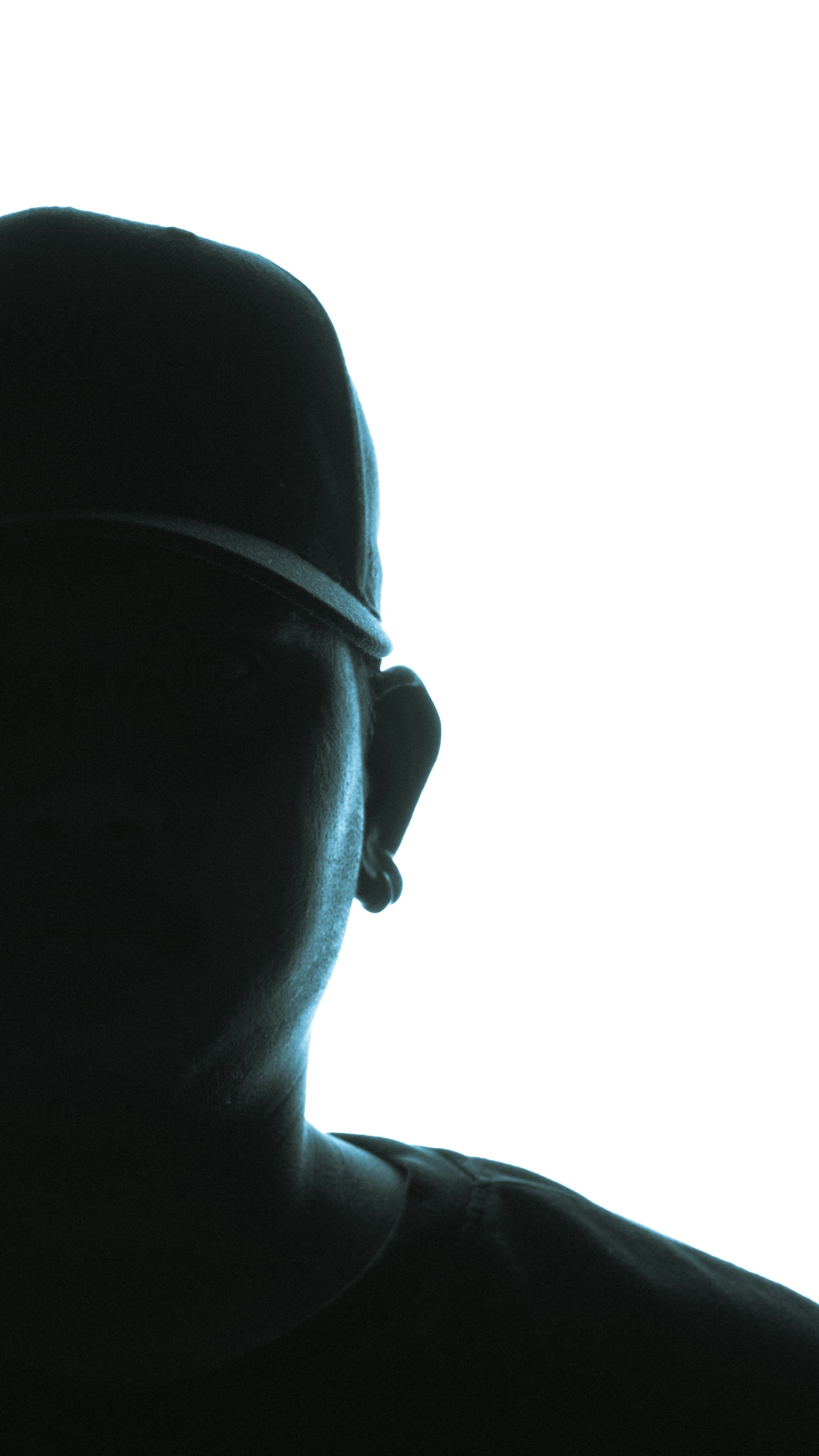 Backlit Portrait in Shadowed Minimalism