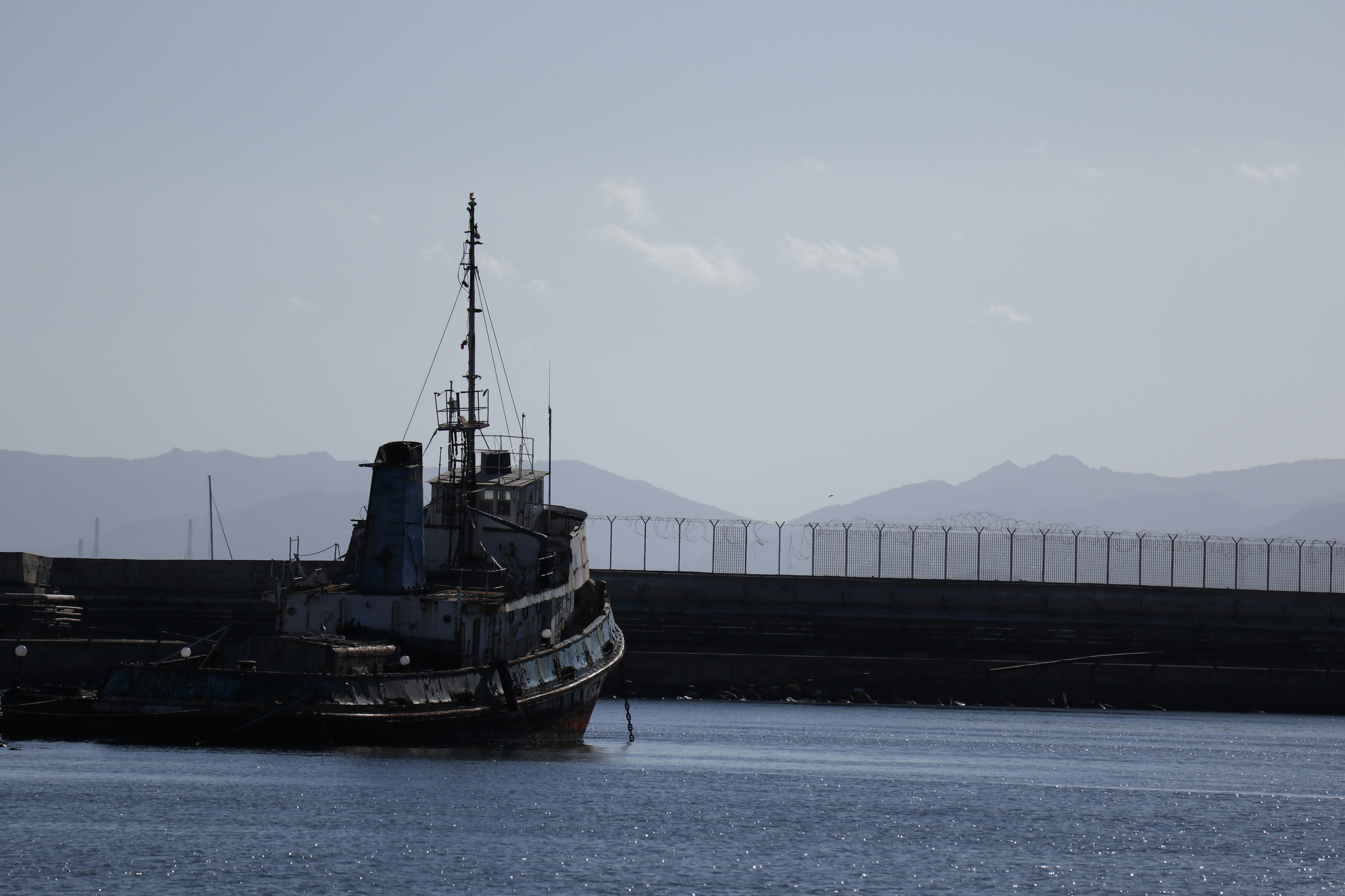 Coastal Tug at Dusk: A Quiet Harbour Scene
