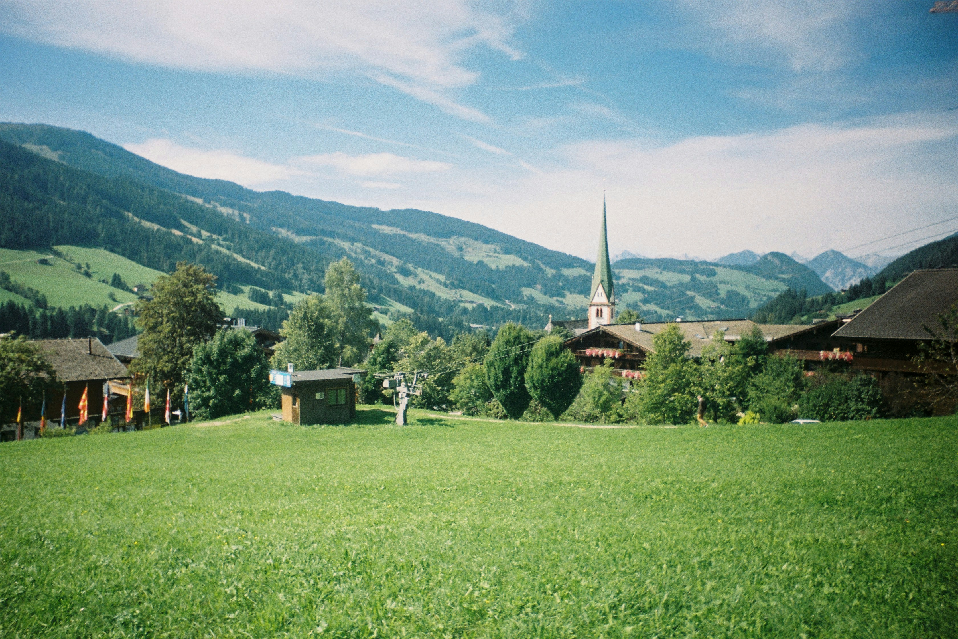 Verdant Valley with Alpine Village and church spire