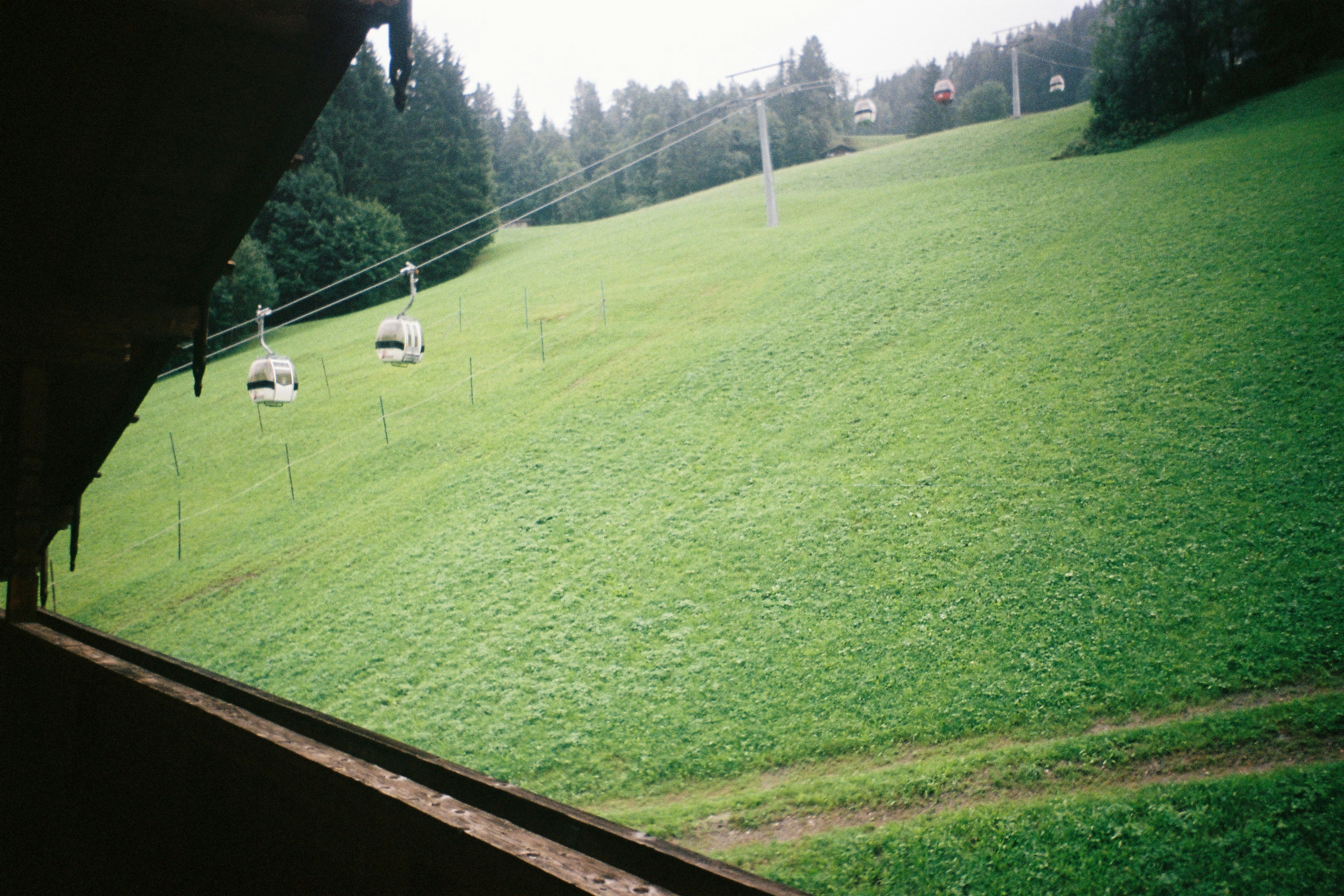 Cable Car Glide Over a Verdant Slope