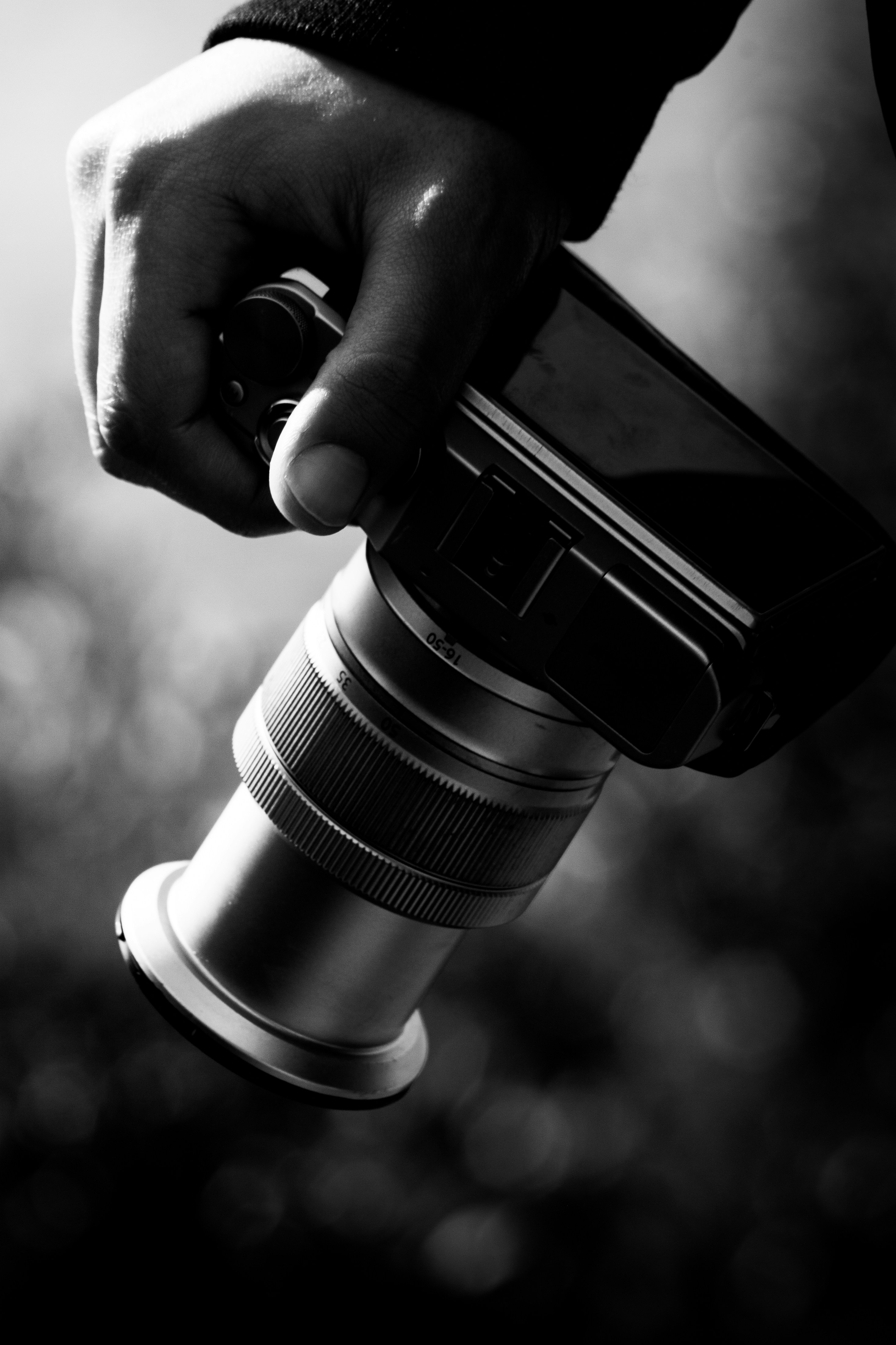 Grasping Light: A Close-Handheld Perspective on a Compact Lens