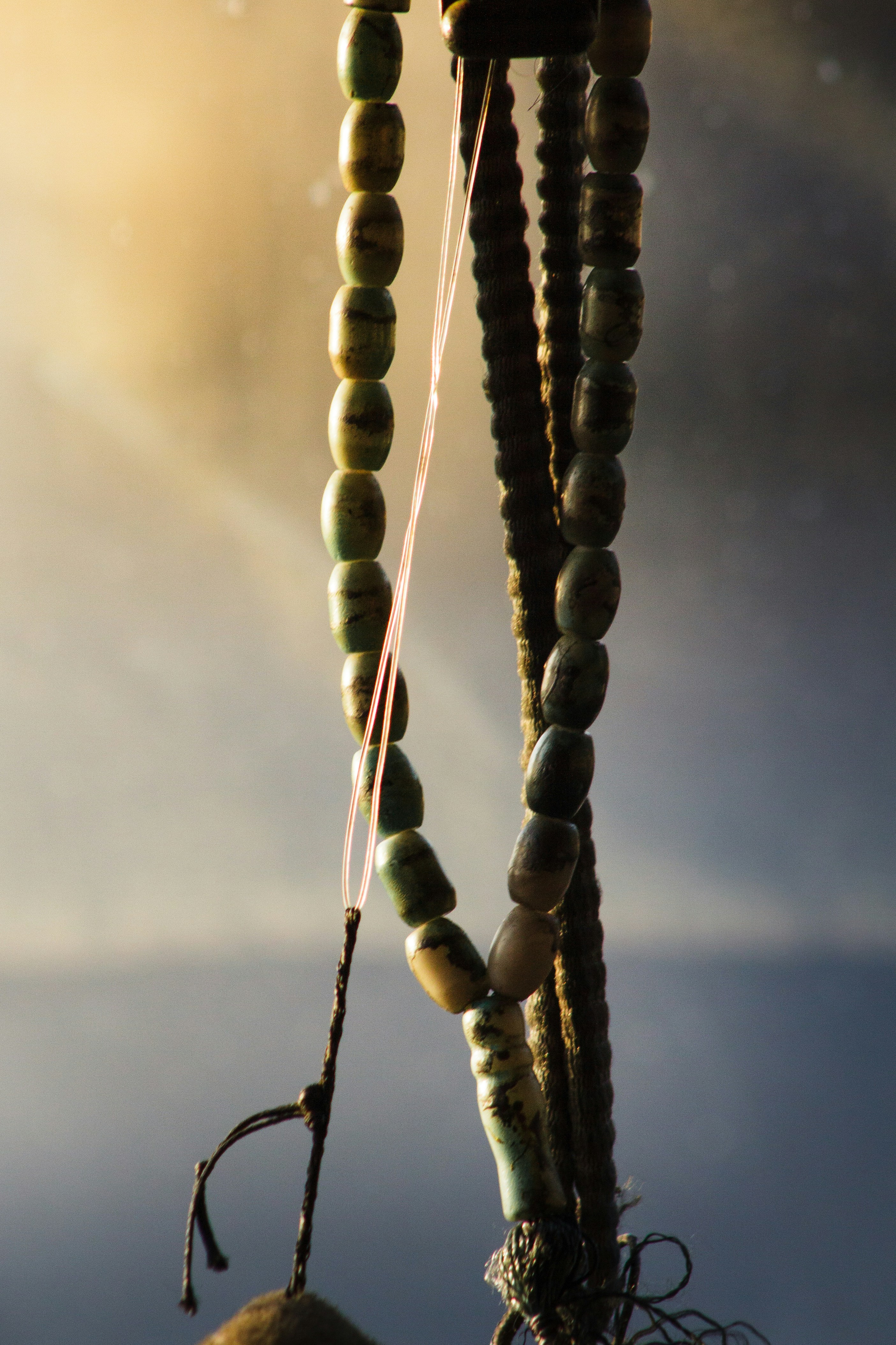 Beaded Threads in Backlit Quiet