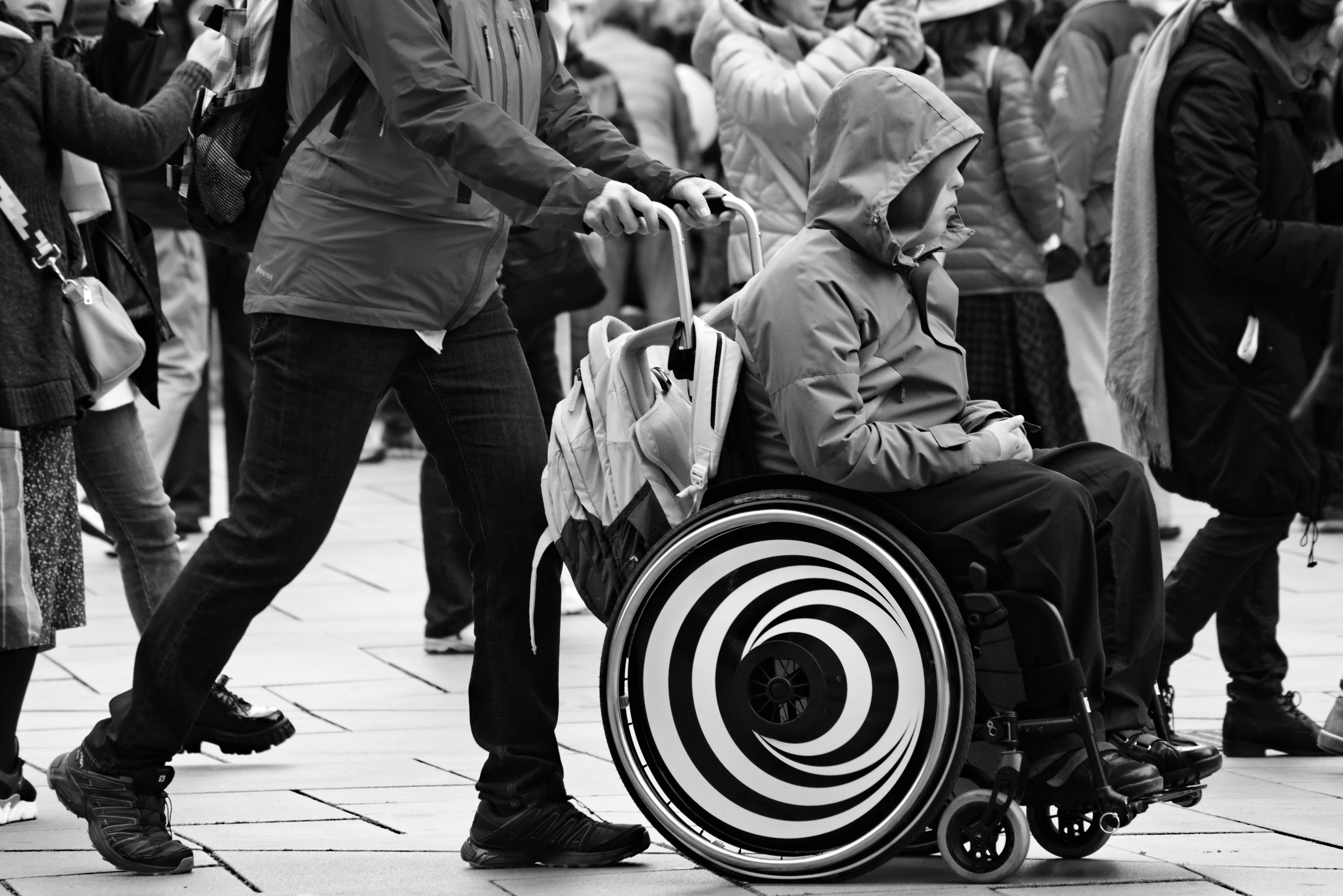 Wheelchair in a Sea of Moving Feet