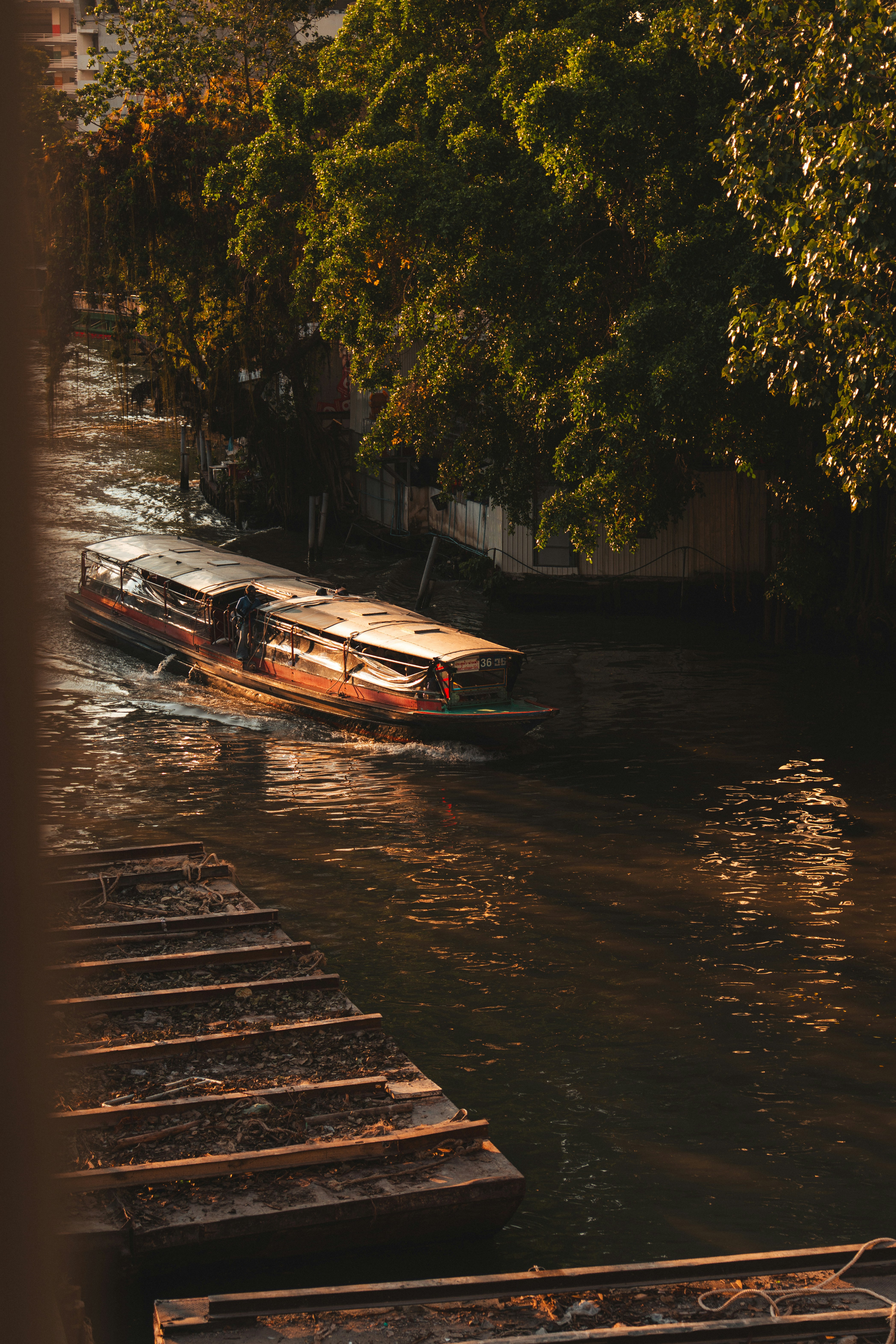 Amber Boat on Quiet Canal After Sunset