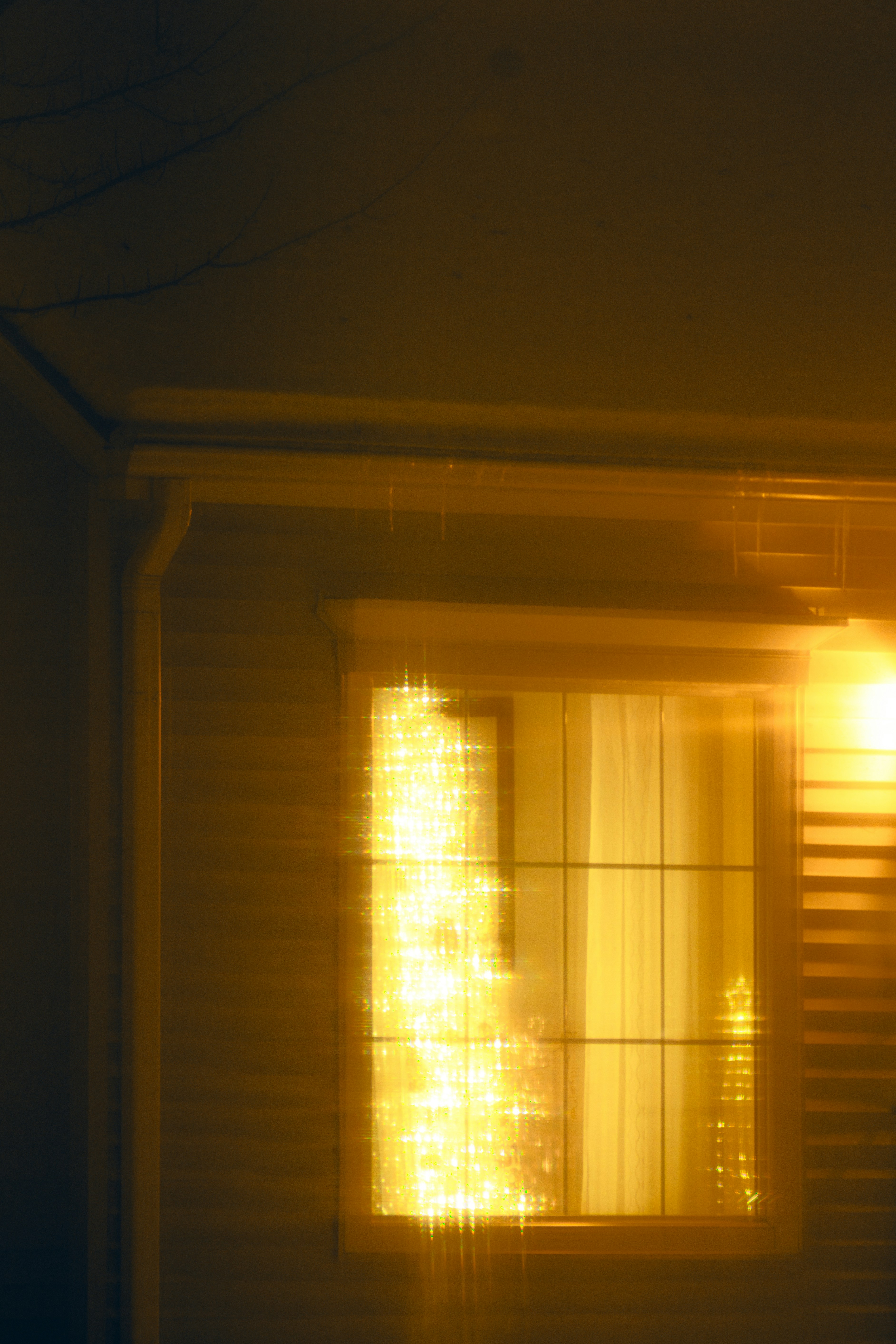 Golden Window Glow in a Nighttime Facade