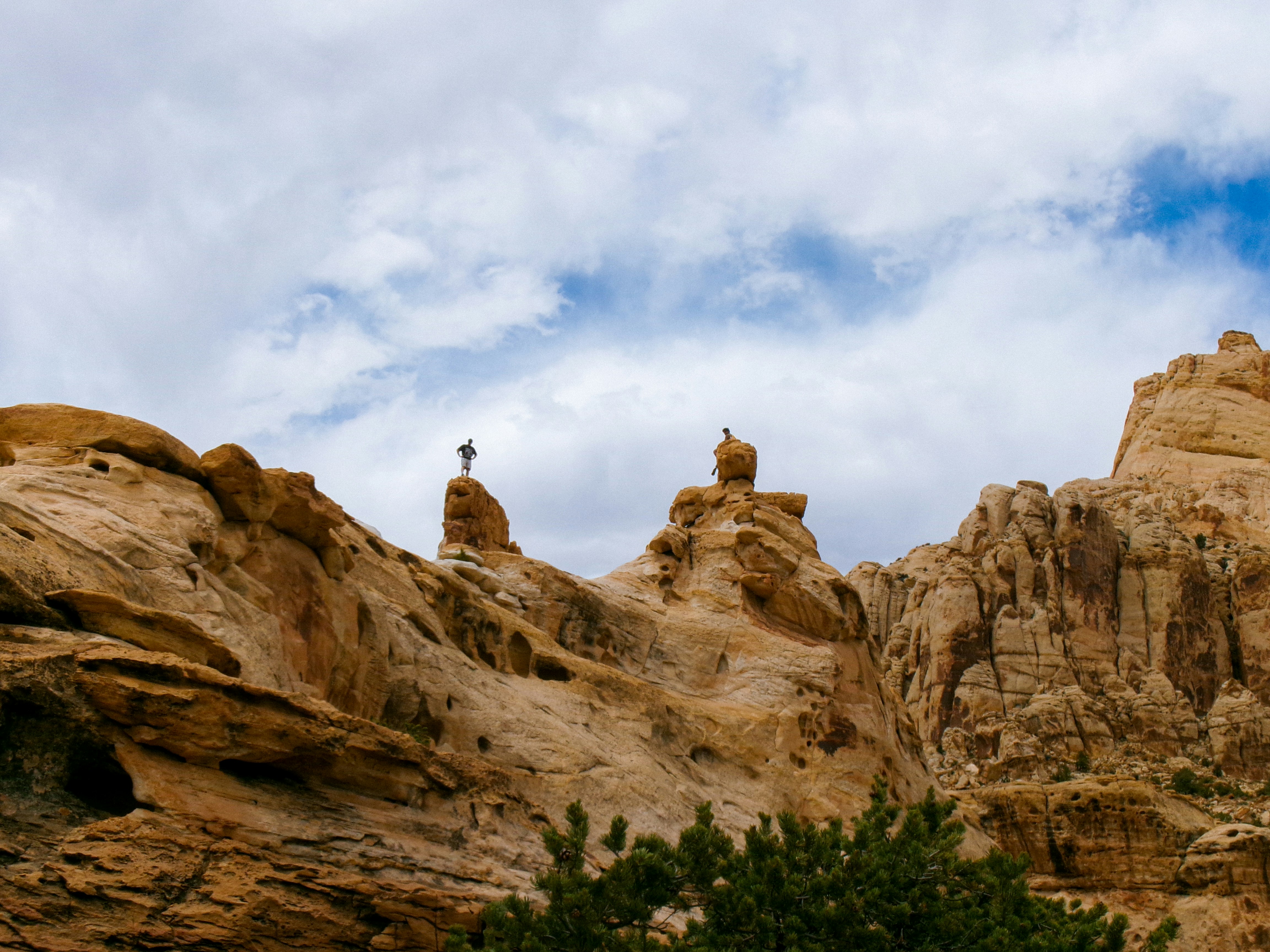 Figure on the ridge: a lone silhouette among sculpted stone sentinels