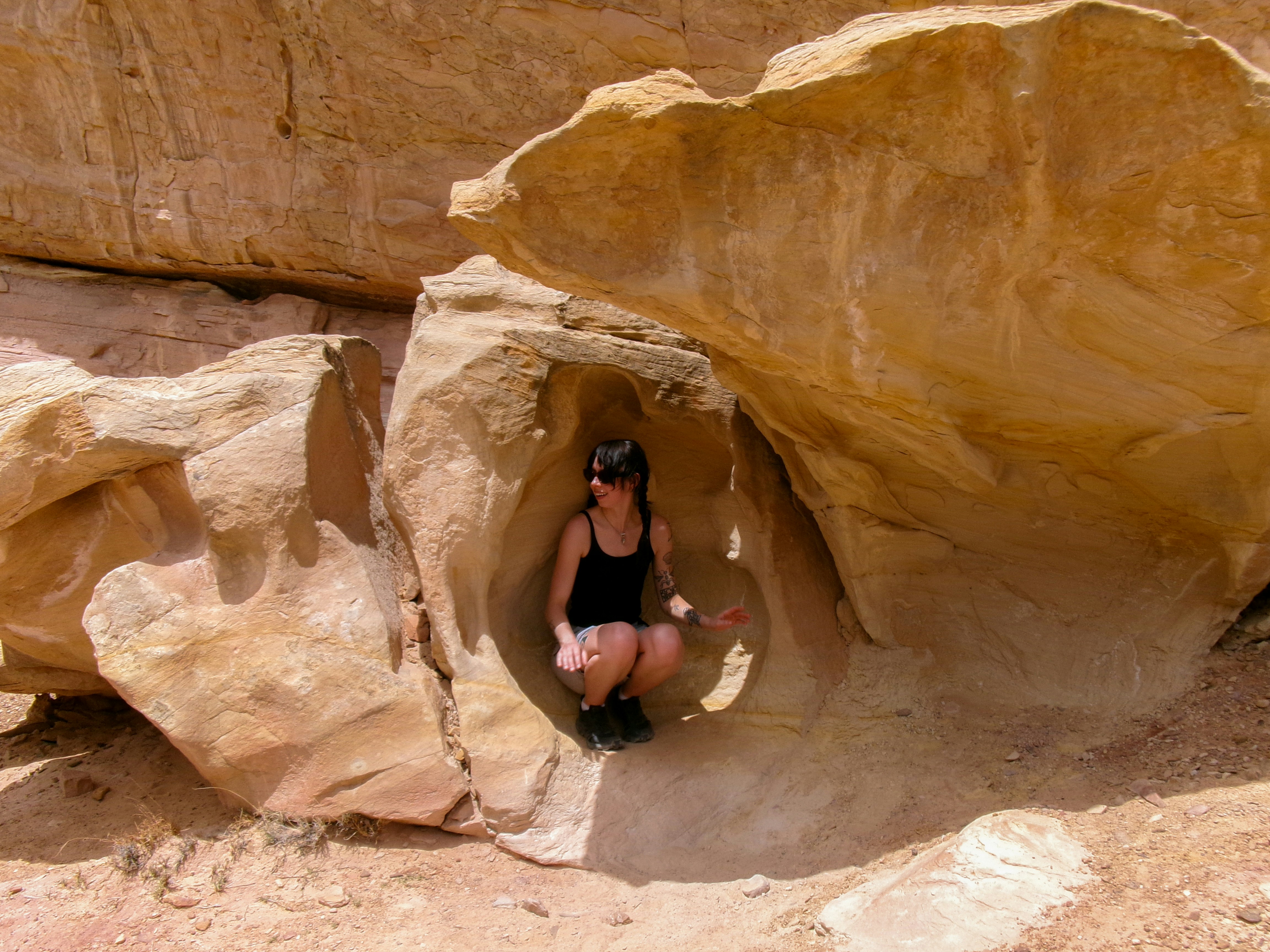 Hidden Cave Portrait: A Solo Moment in Warm Sandstone