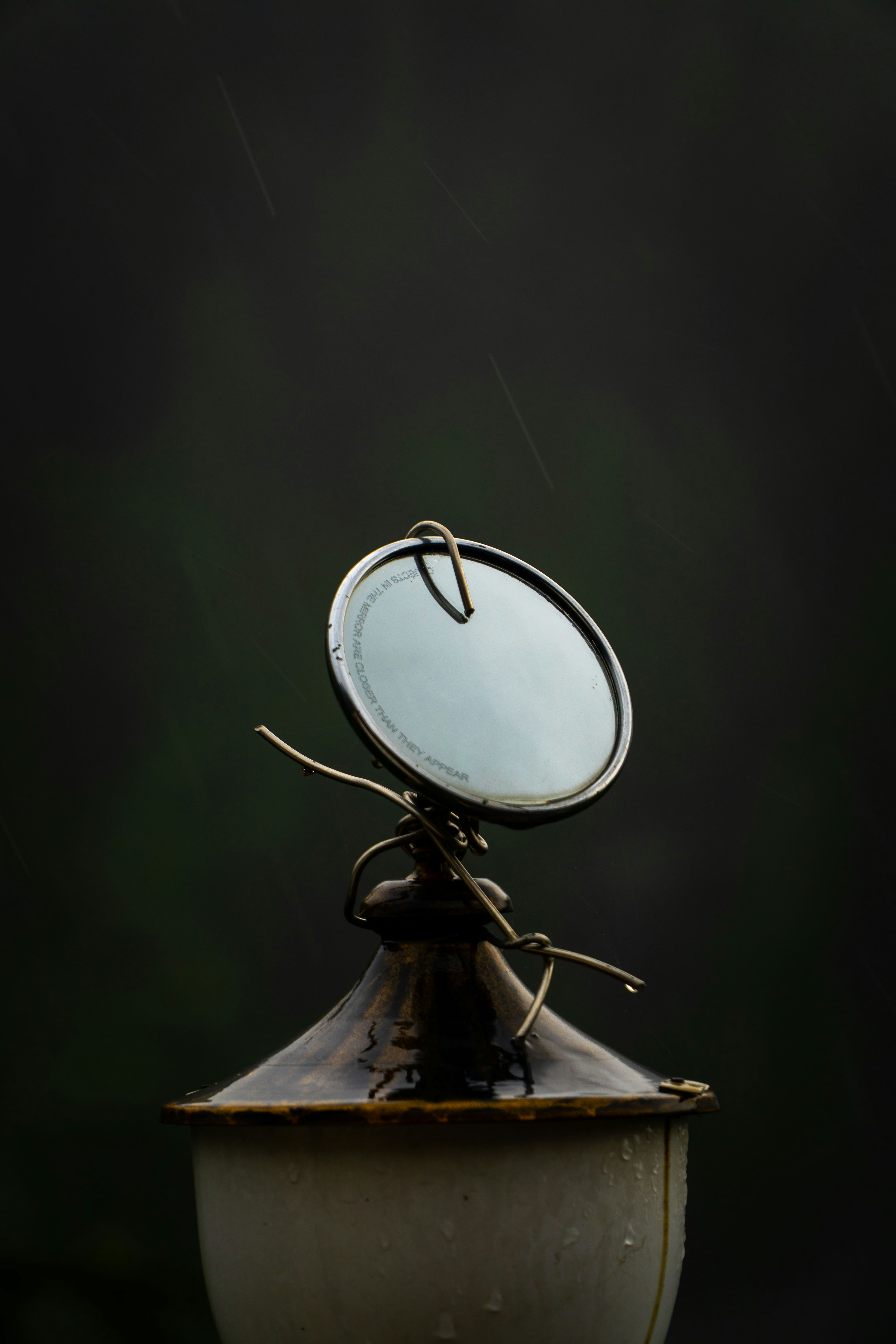 Raindrops on a Weathered Spotlight