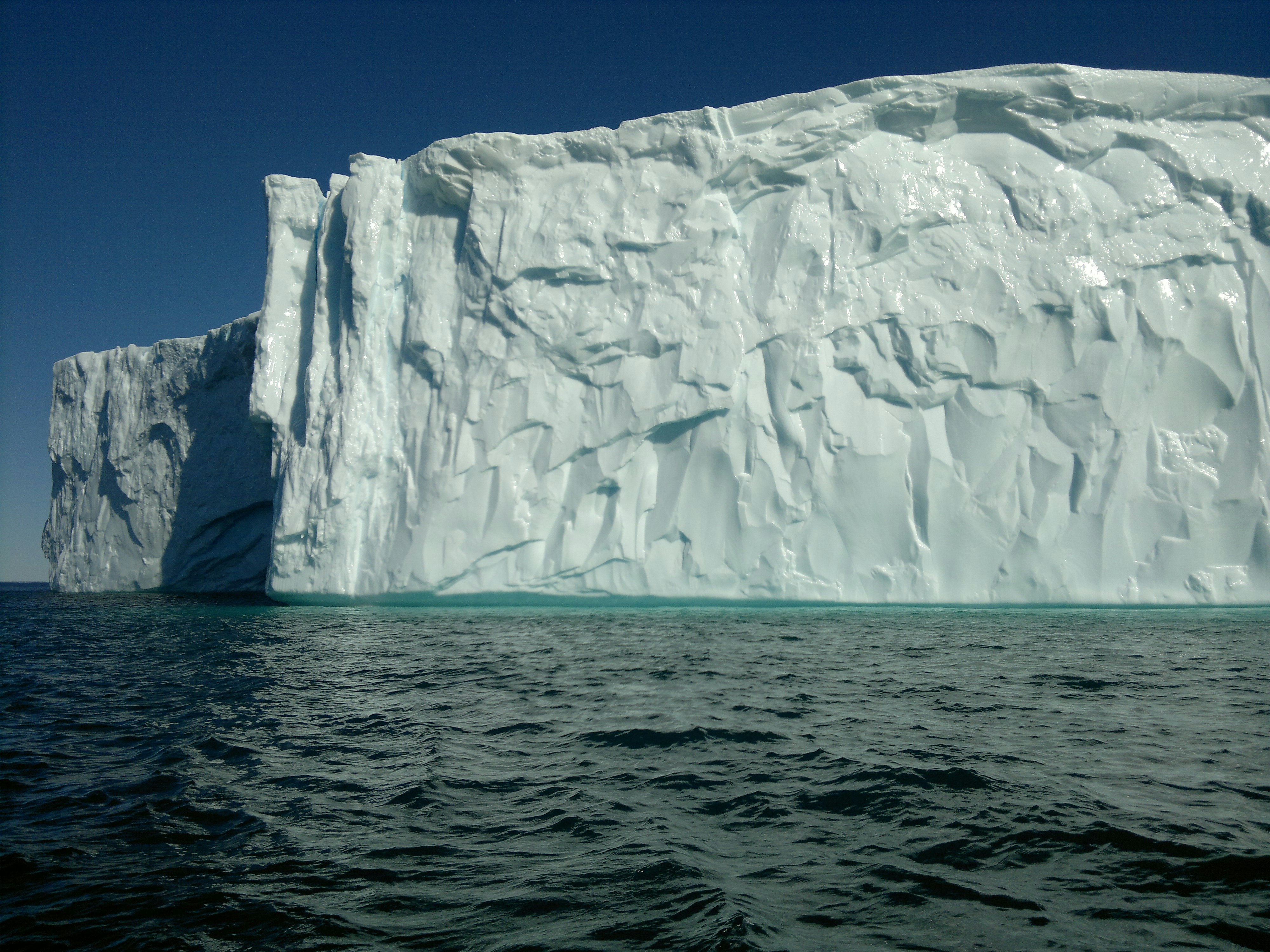 Monolithic Glacierfront: Sunlit Ice and Dark Sea