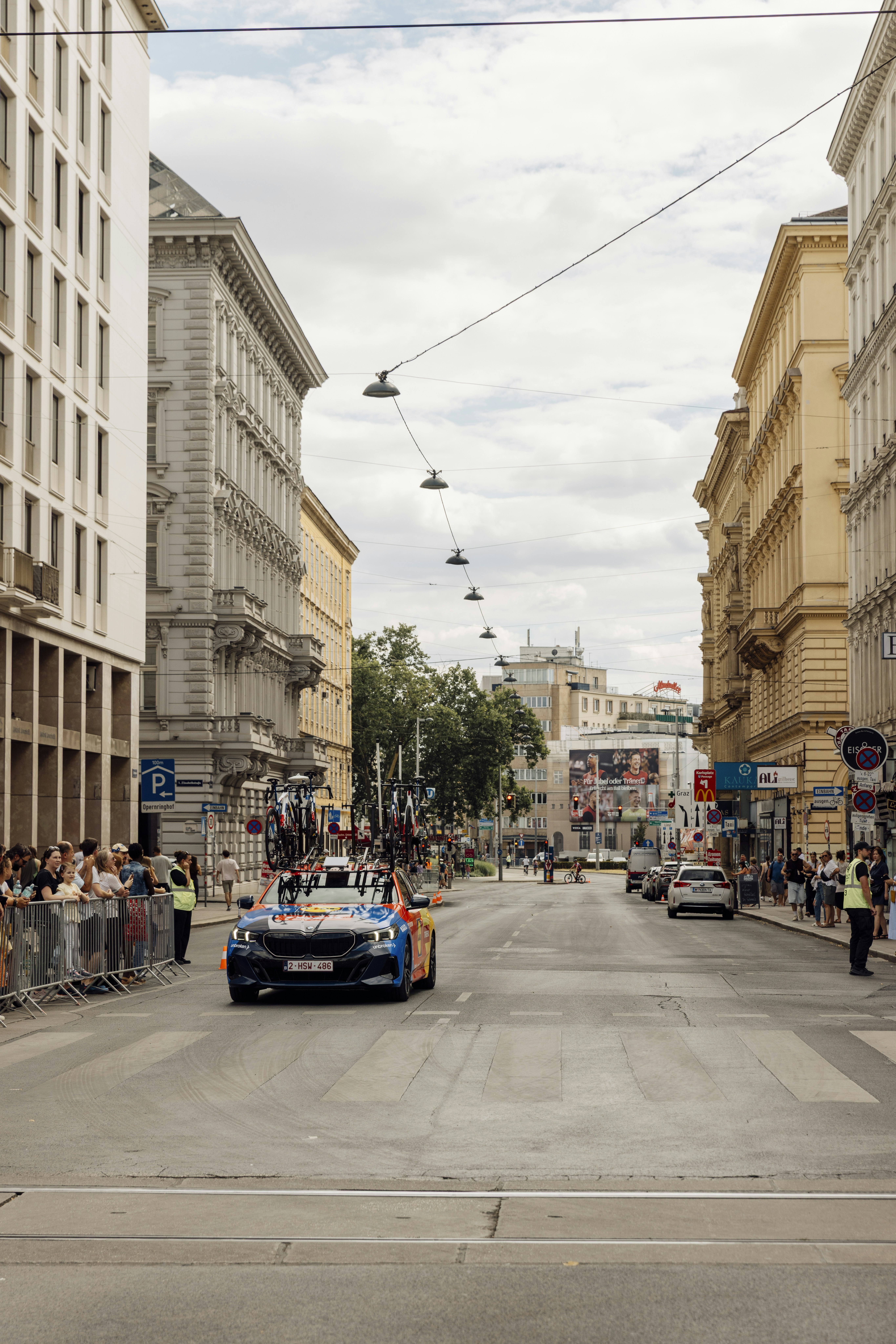 Street Sprint: The Blue Pace Car on a City Avenue