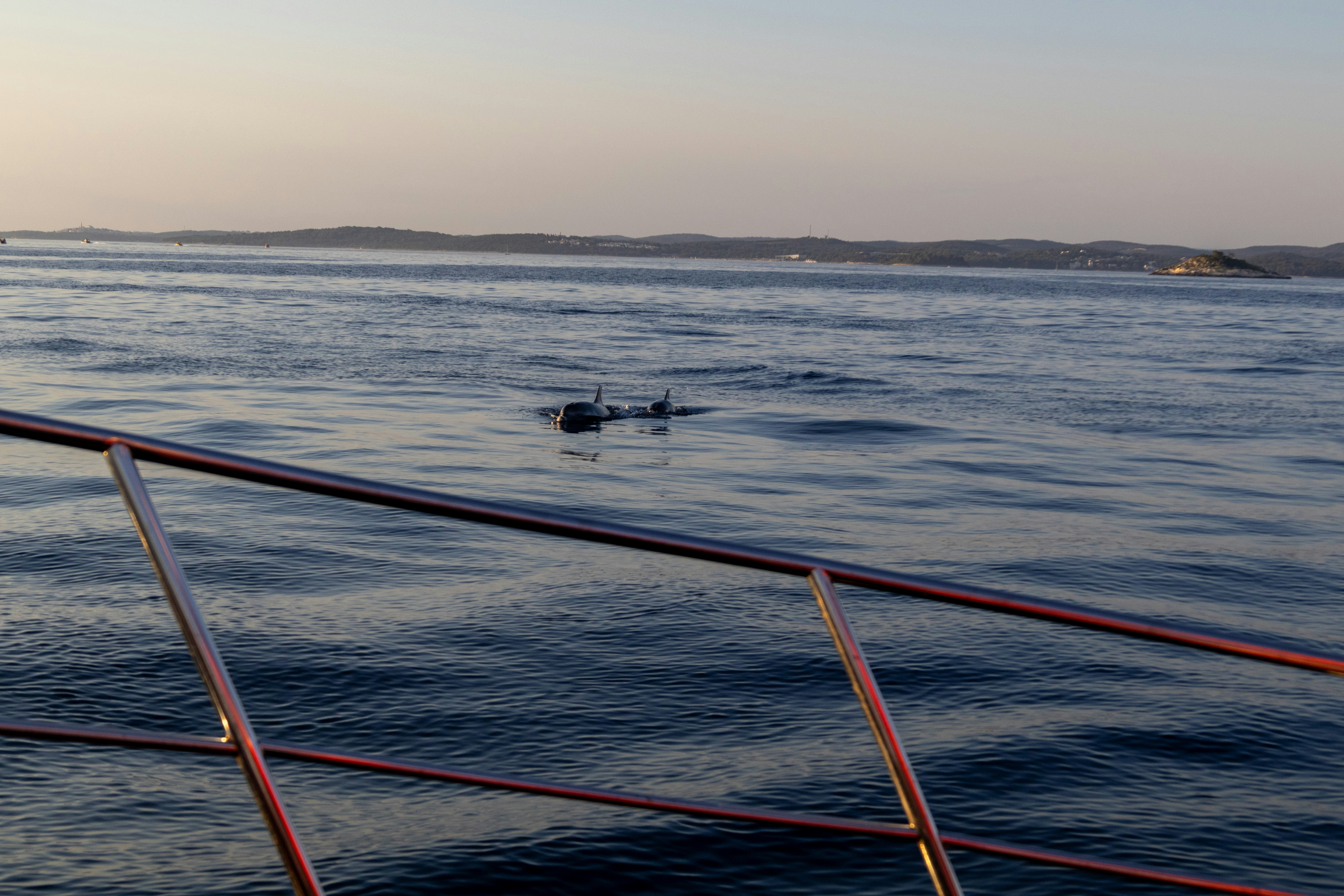 Triplet of Sea and Sky: A Small Boat Resting Among Tidal Waves