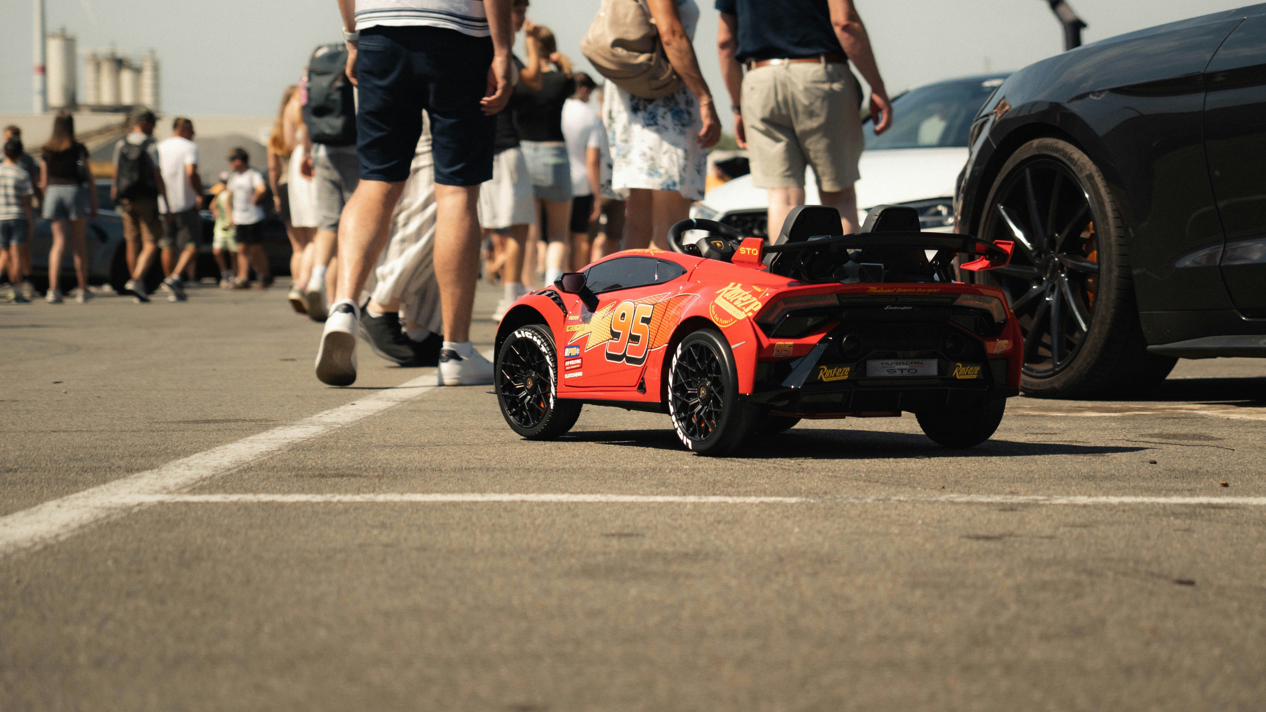 Small Red Racer Among Big Footsteps