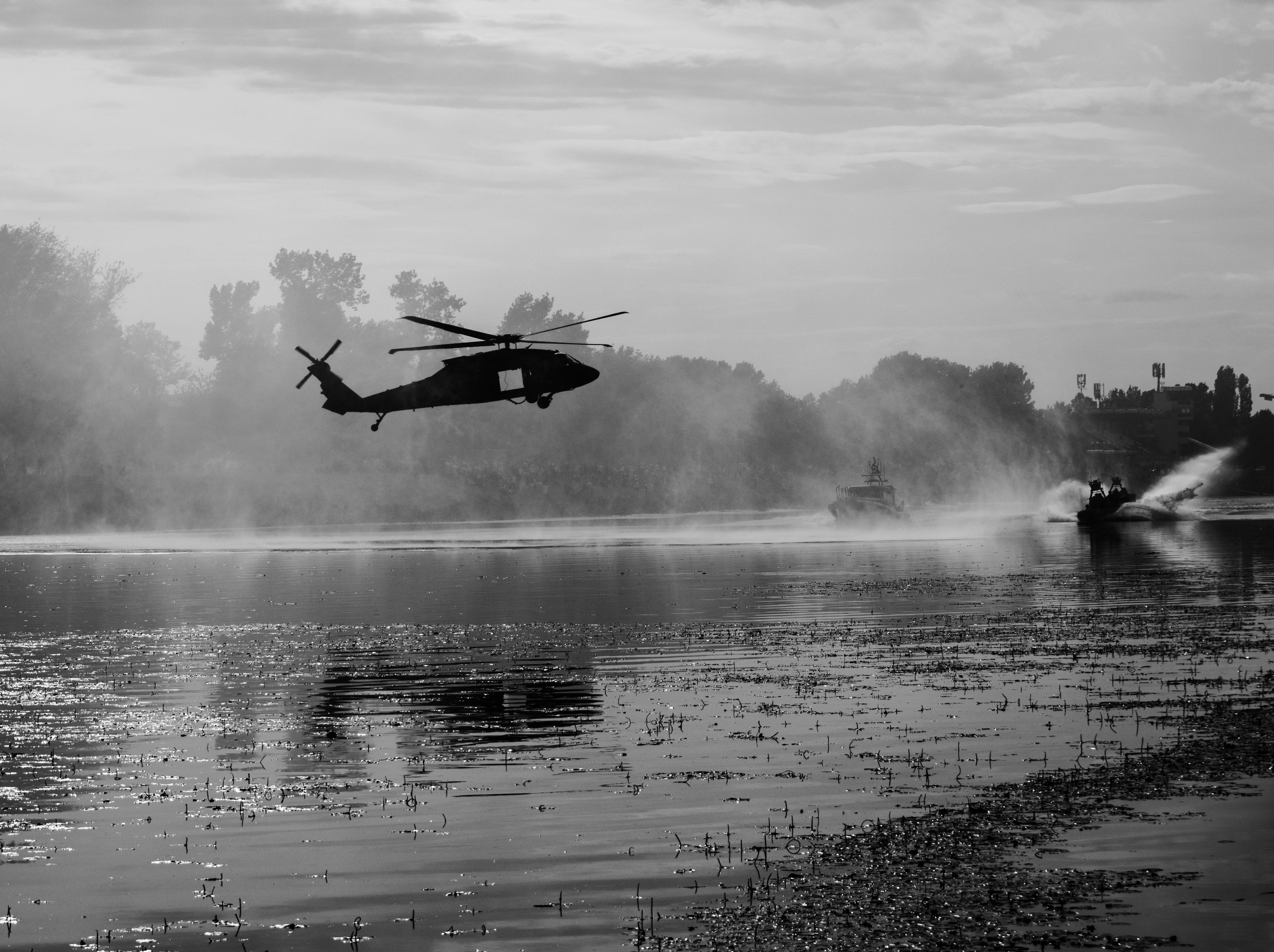 Helicopter Skim Over Silent Water at Dusk