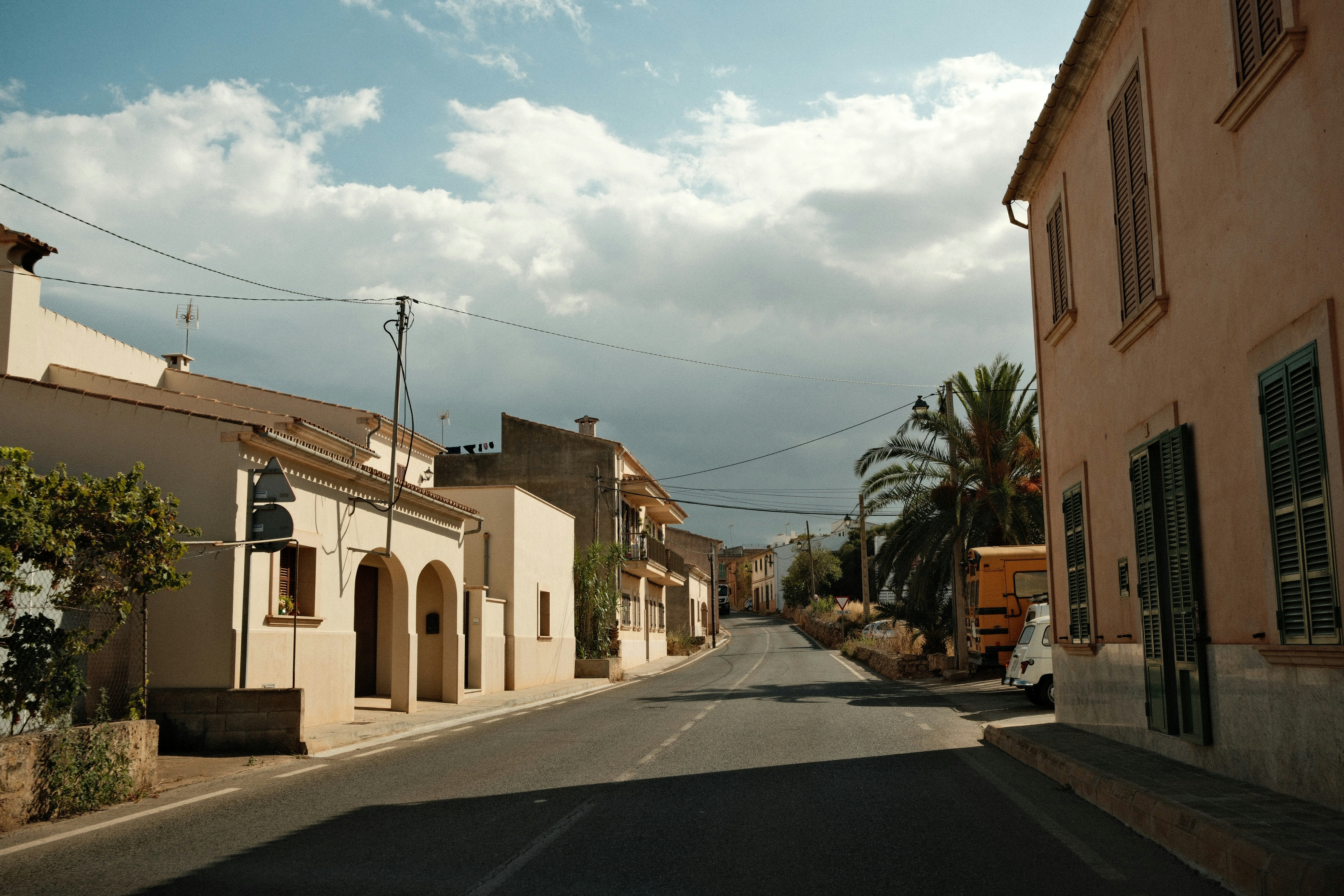 Sunlit Mediterranean Street Receding into the Horizon