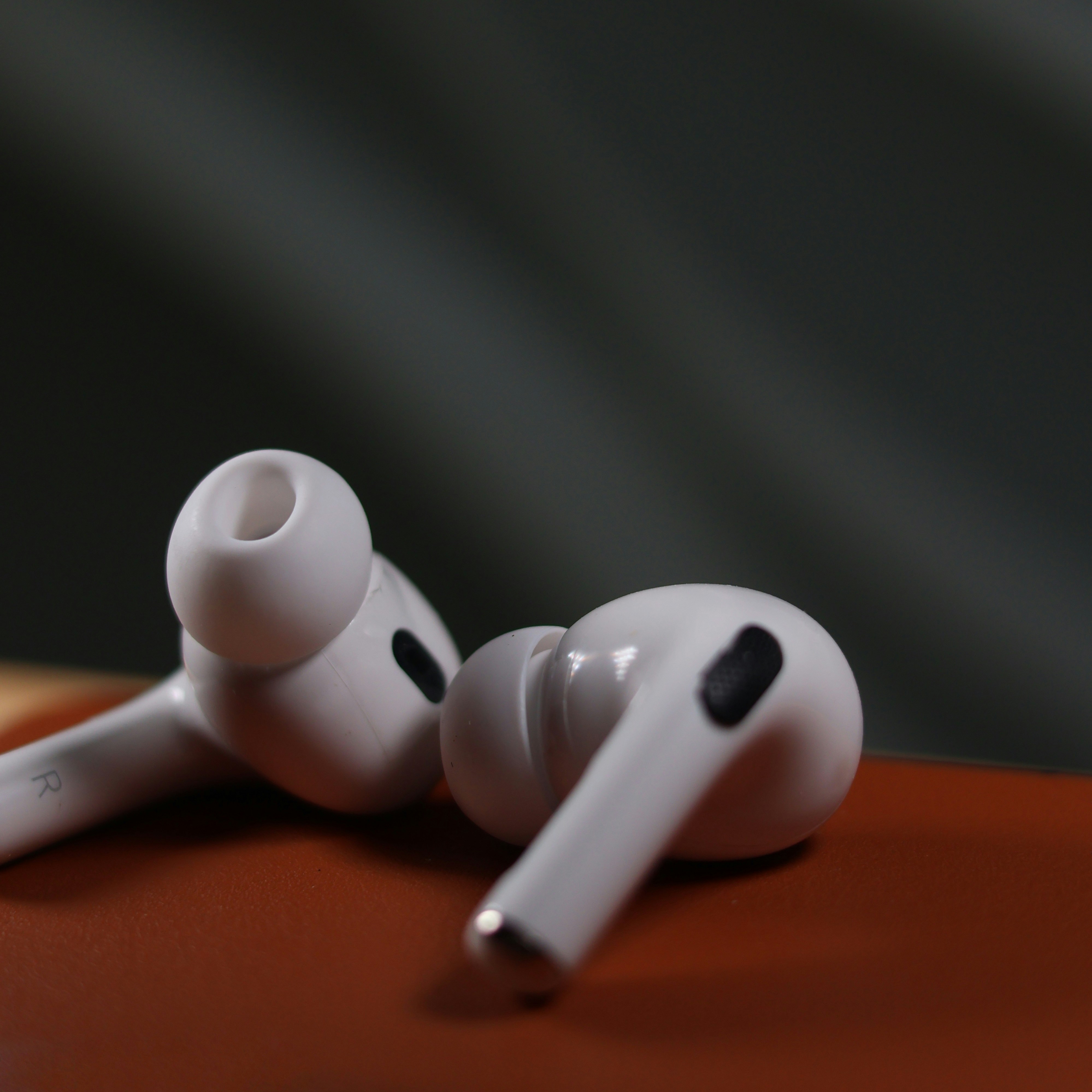 White AirPods Pro on a Red Surface: Quiet Moment of Detail