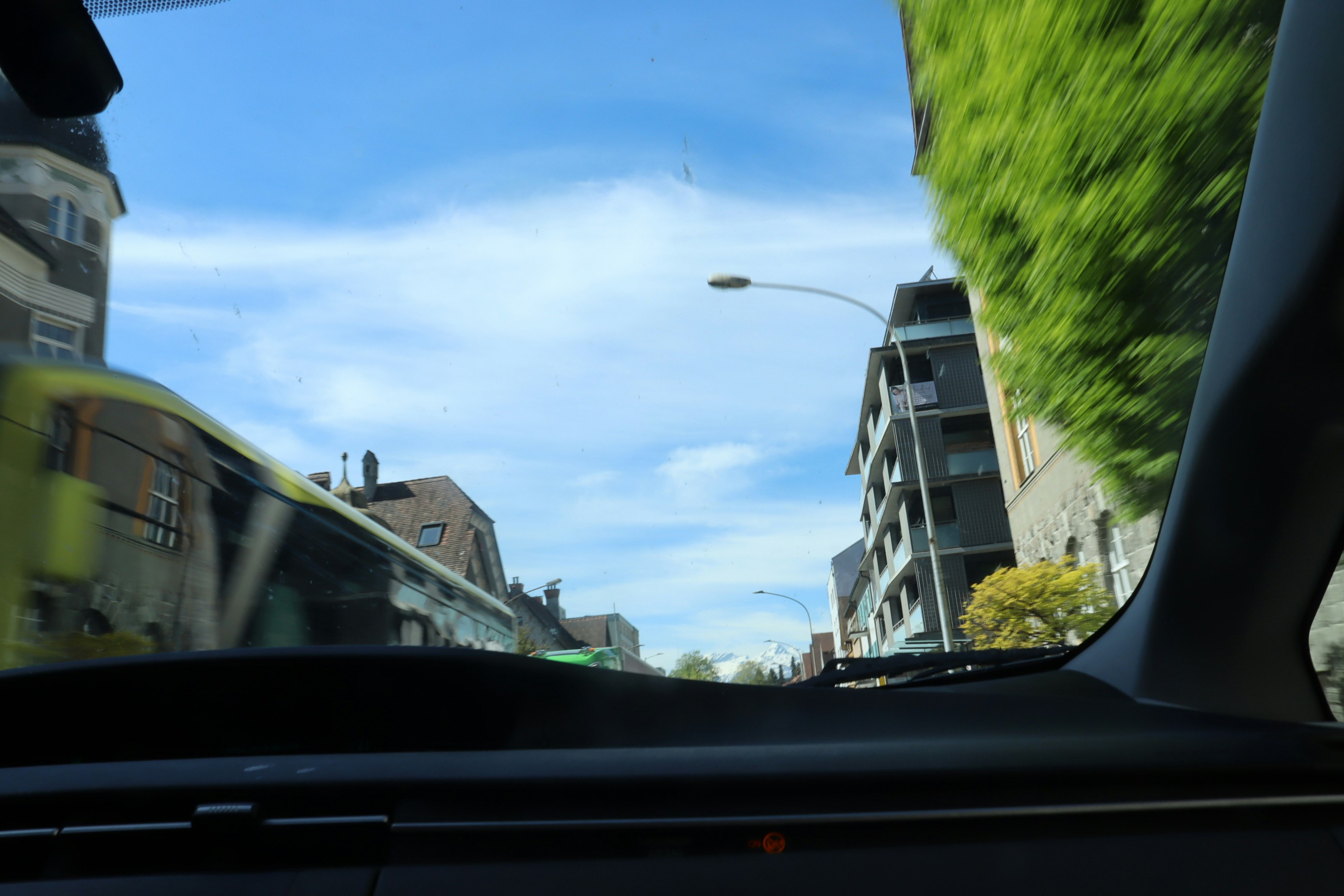 Rushing Avenue: Skyward Blue Above a Quiet City Drive