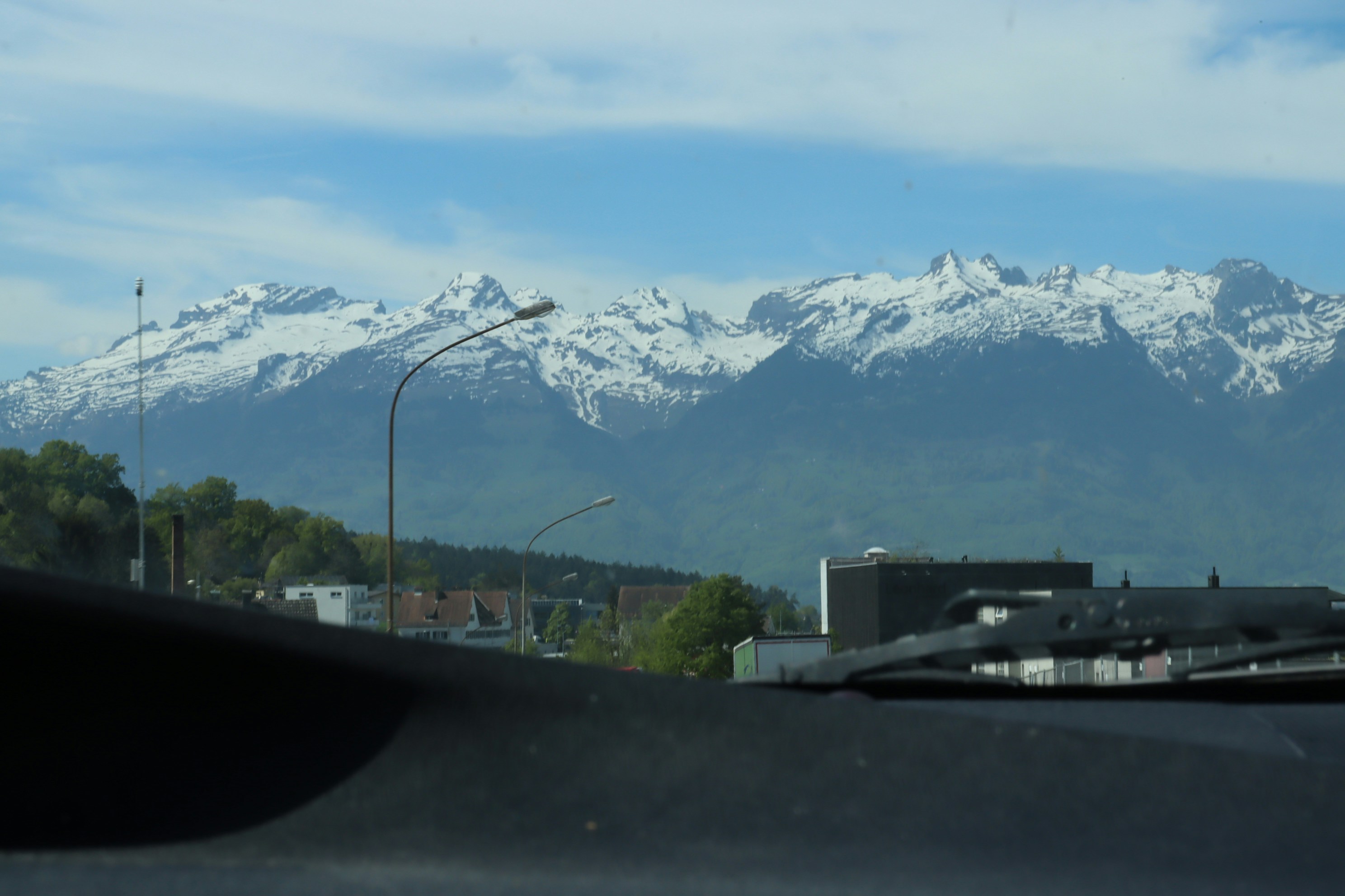 Snowcapped Peaks Beyond the Dashboard Glass