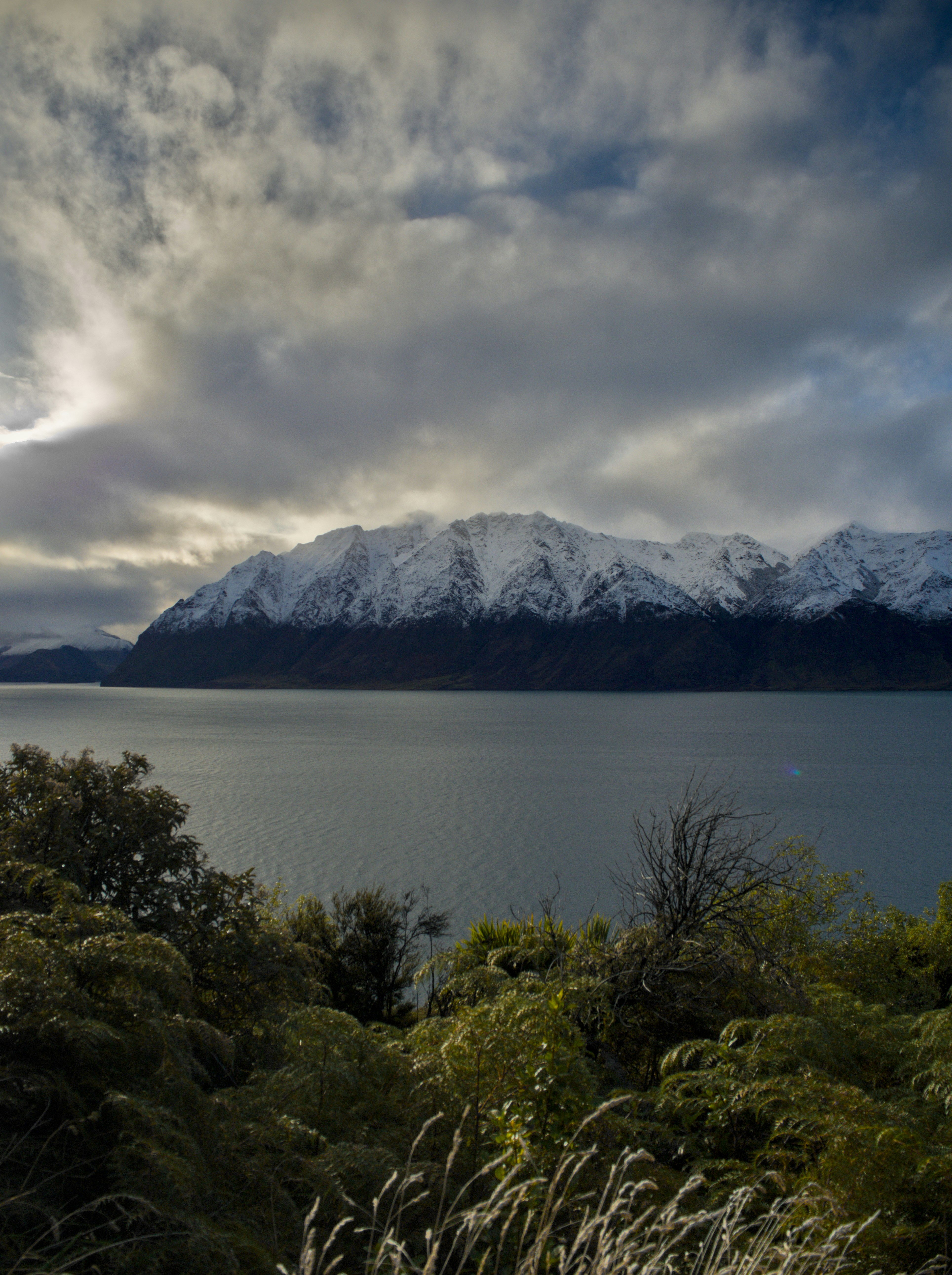 Snow-Capped Ridge Reflects on a Quiet Inland Sea